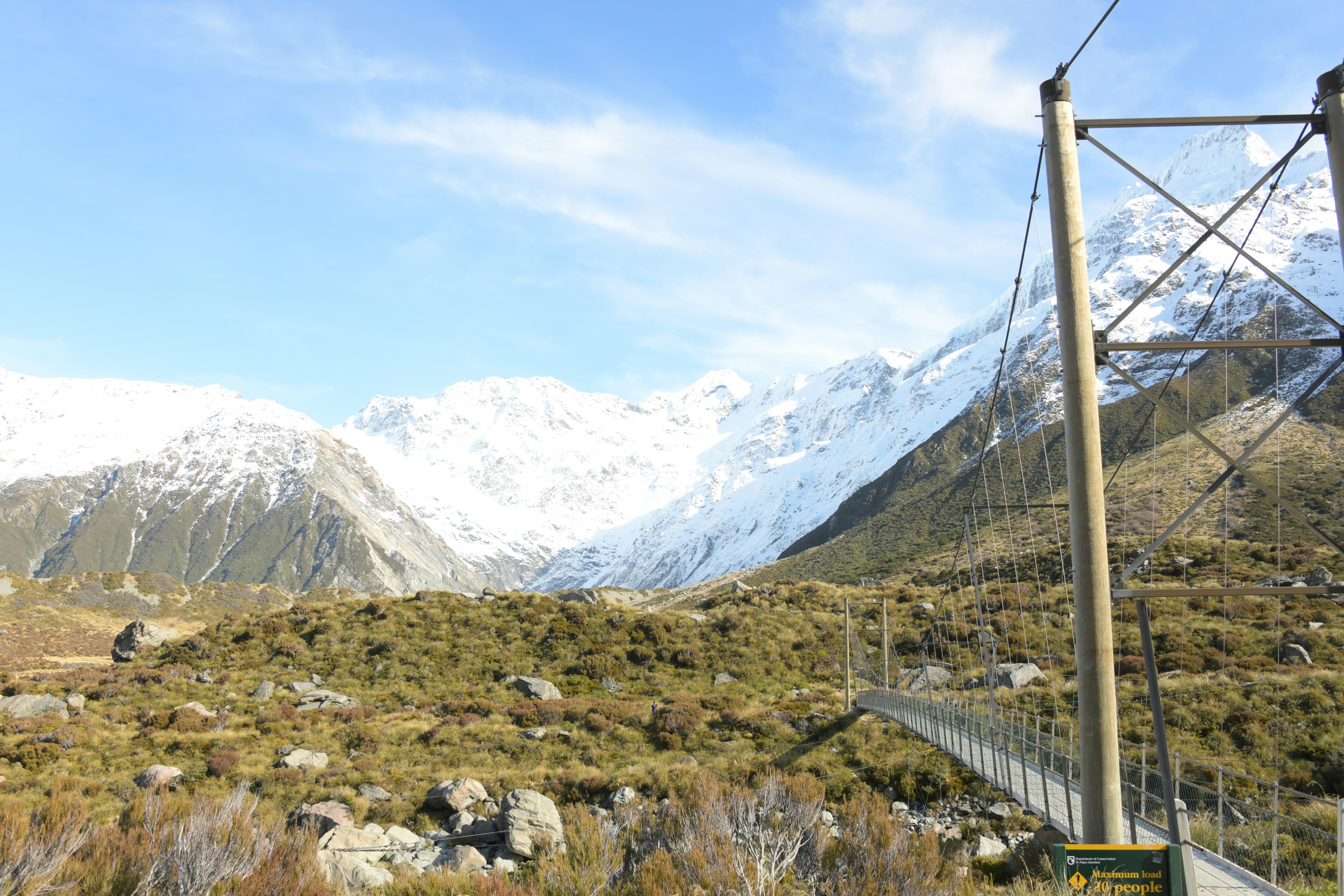 Suspended Trail Beneath Snow-Capped Peaks