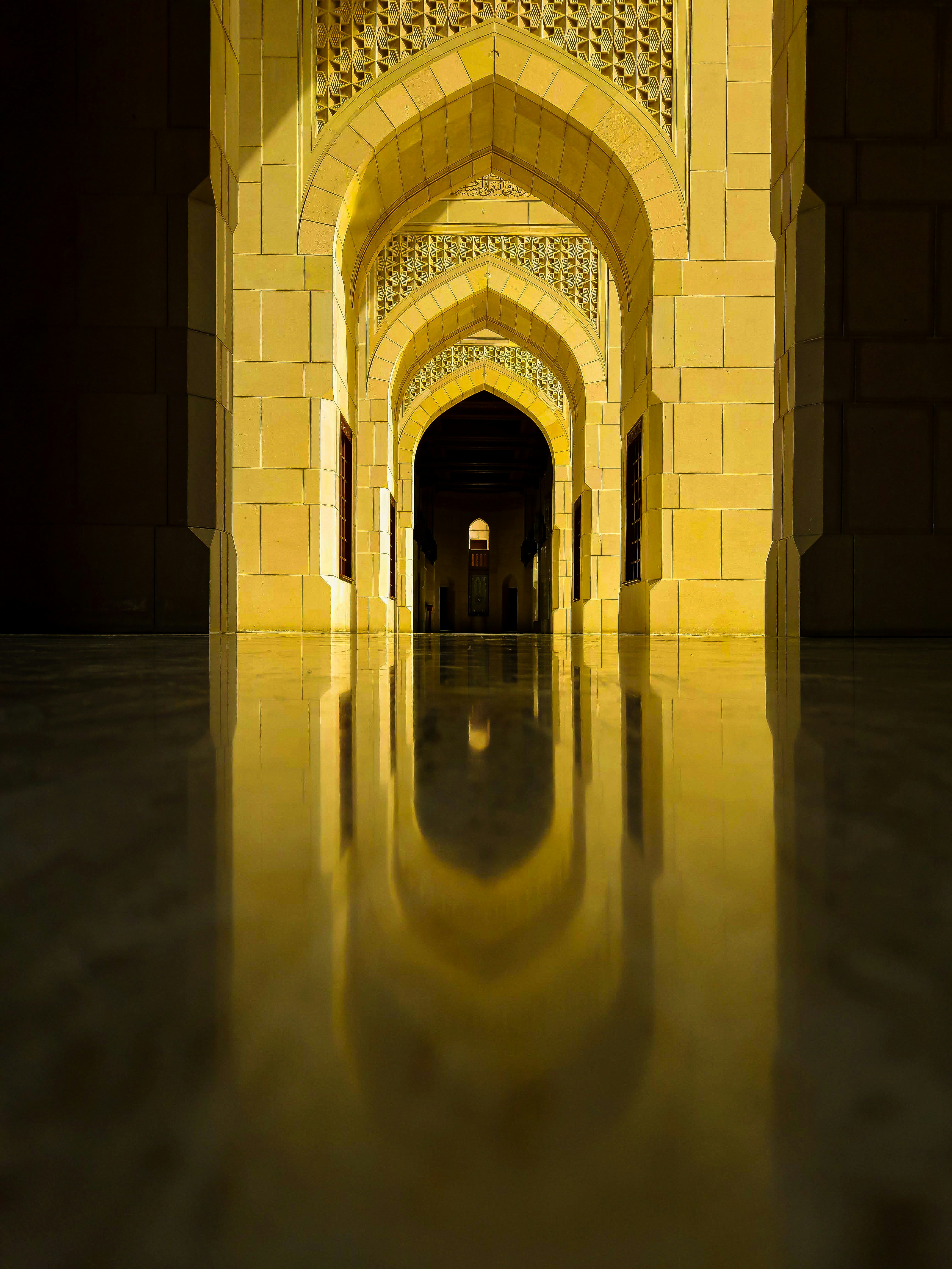 Golden Archway Corridor: Reflections in a Temple Hall