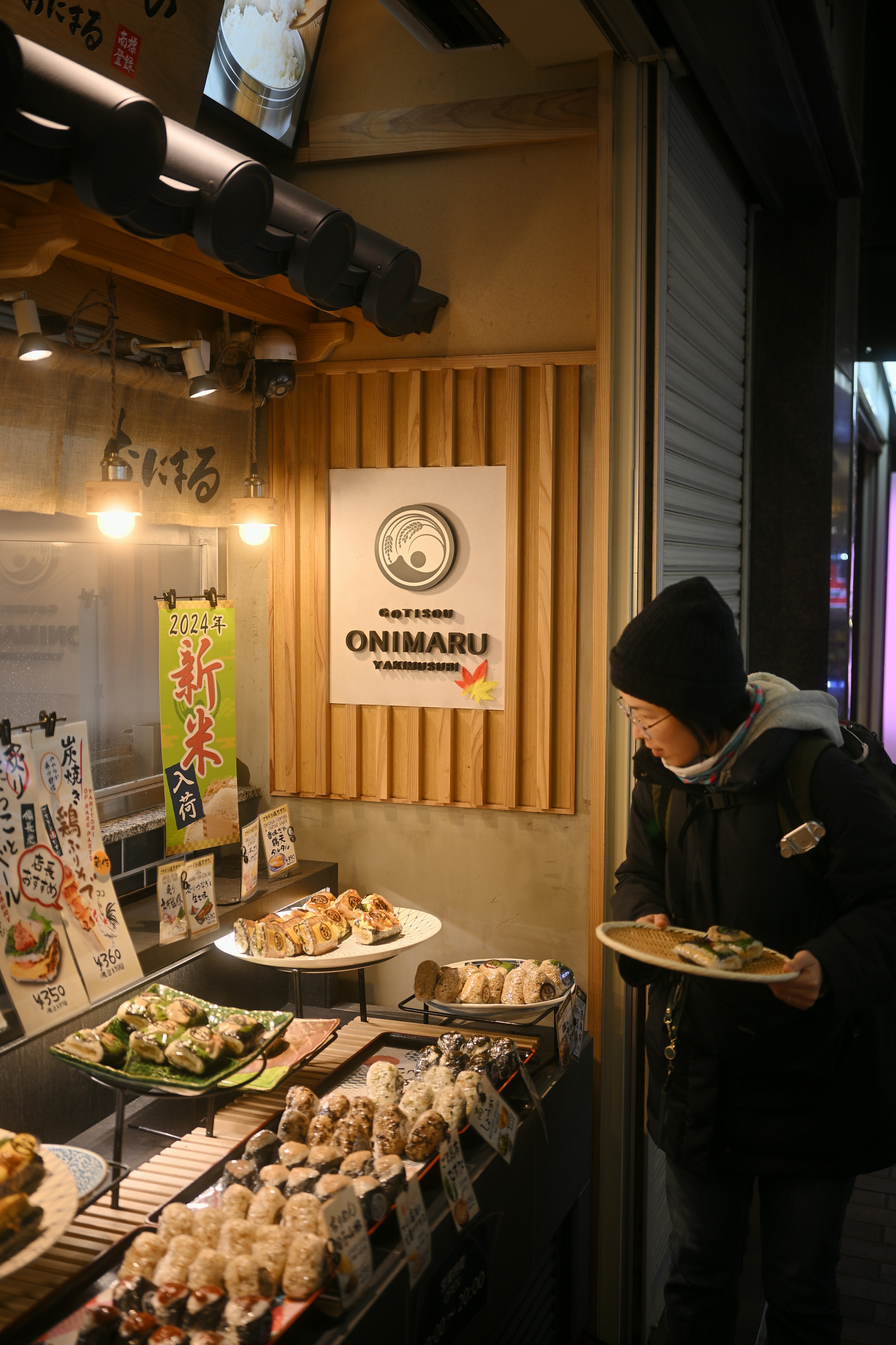 Night Market Stroll: A Baker’s Display and a Quiet Customer