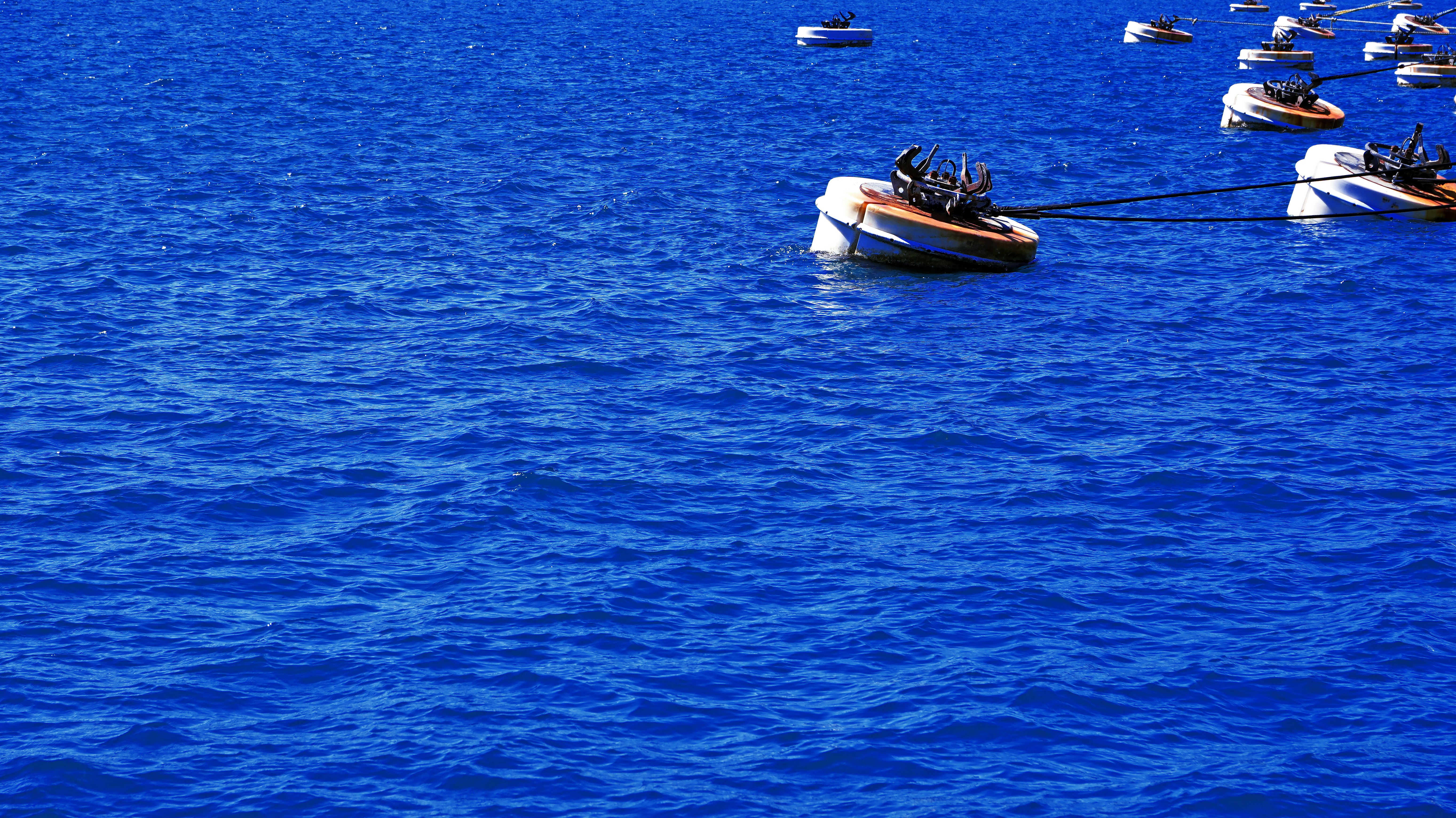 Blue Harbor: A Fleet of Small Boats Adrift in Bright Aegean Light