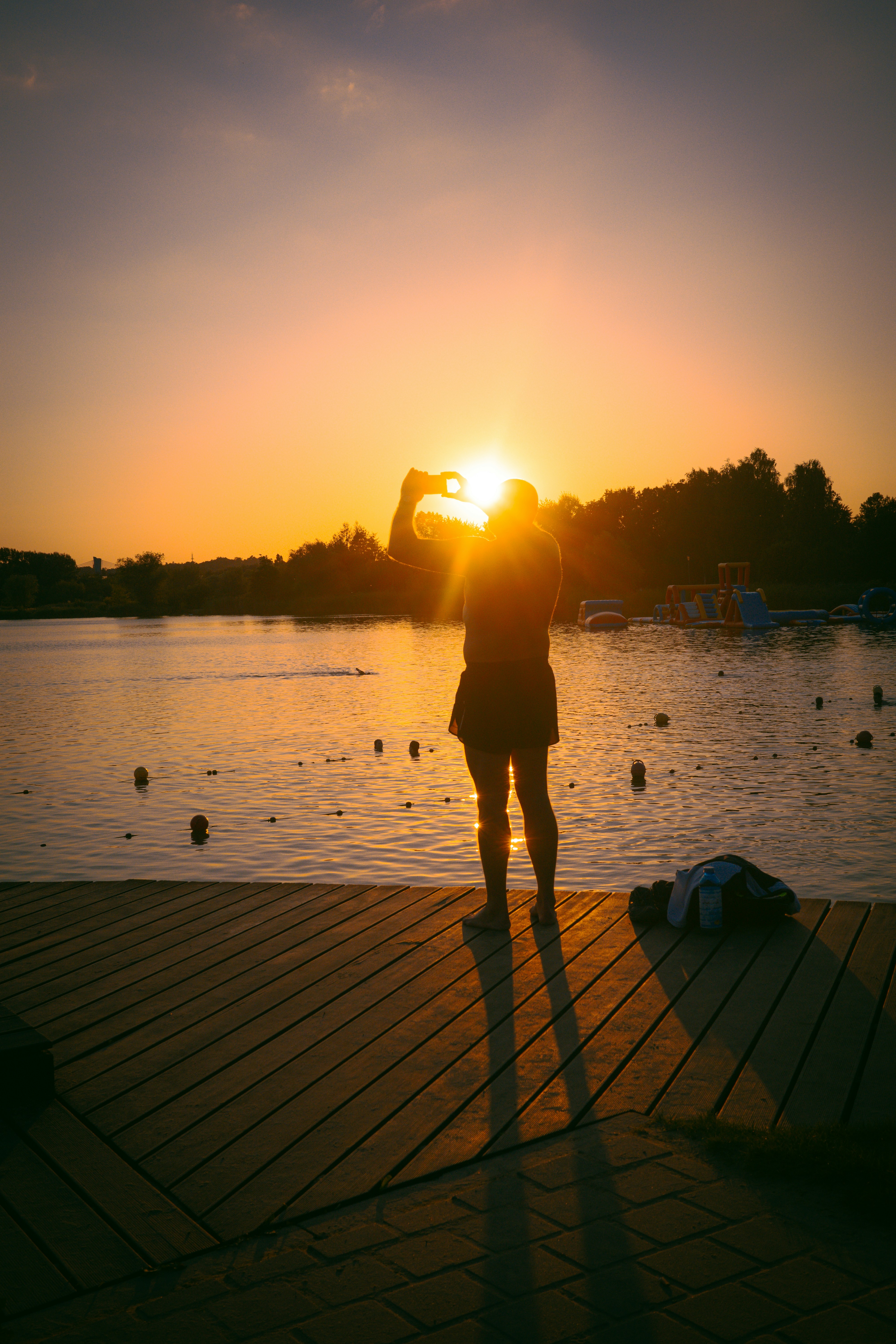 Sunlit Sketch: A Silhouette Captures the Last Light by the Docks