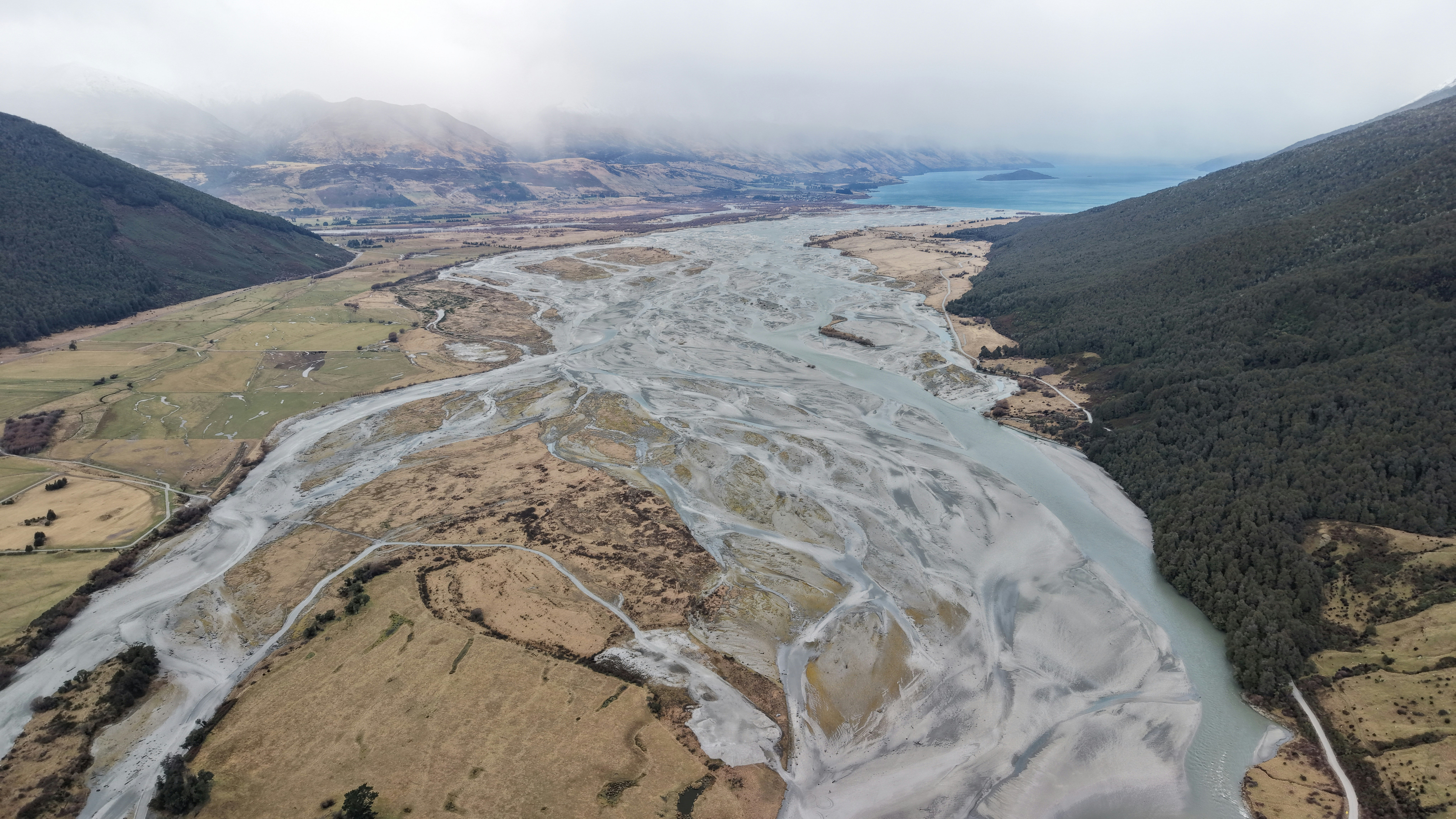 Riverbed Mosaic: A Valley Unfolding Between Hills