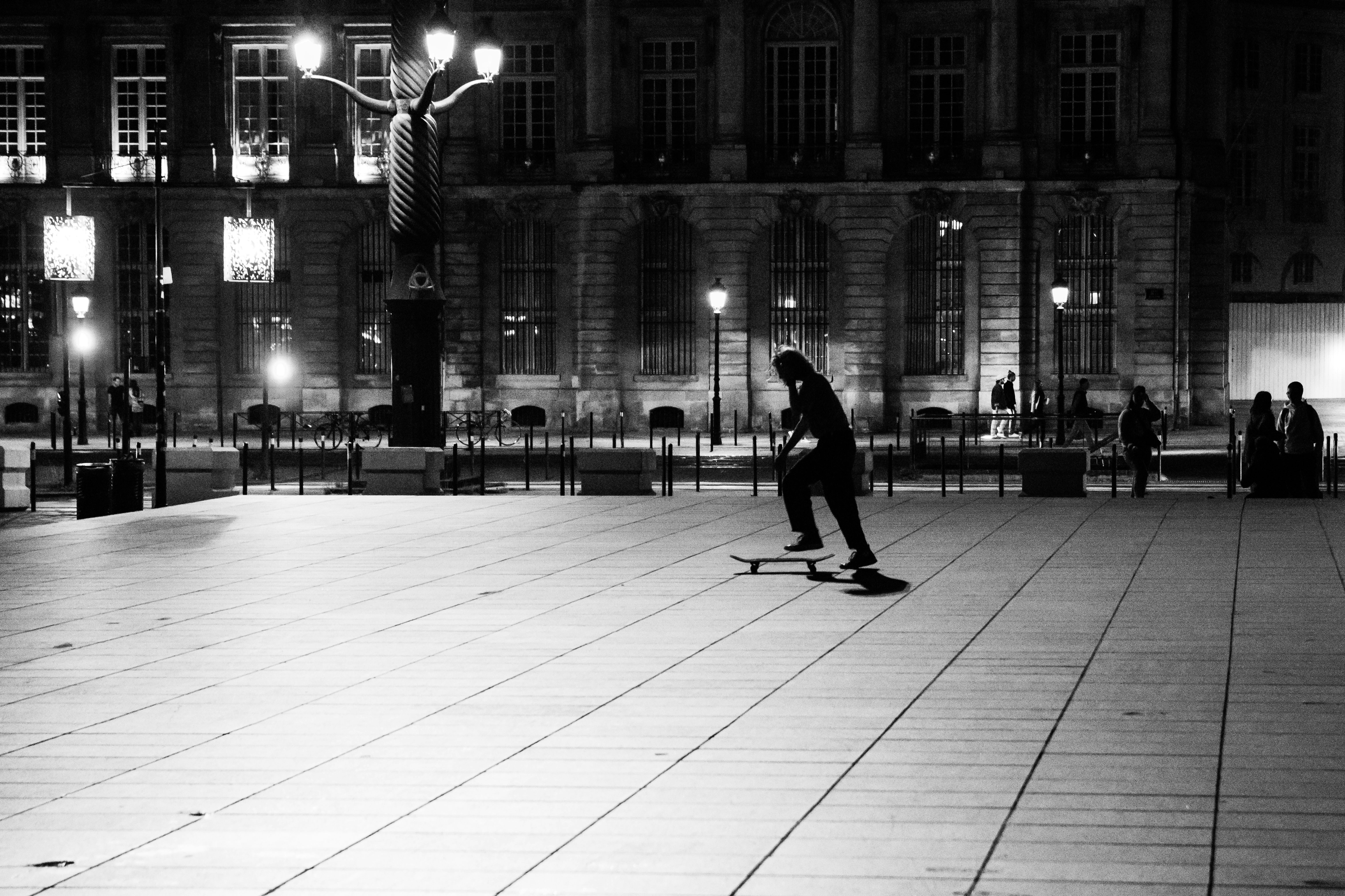 Nocturnal Skate: A Lone Rider in a Quiet Square