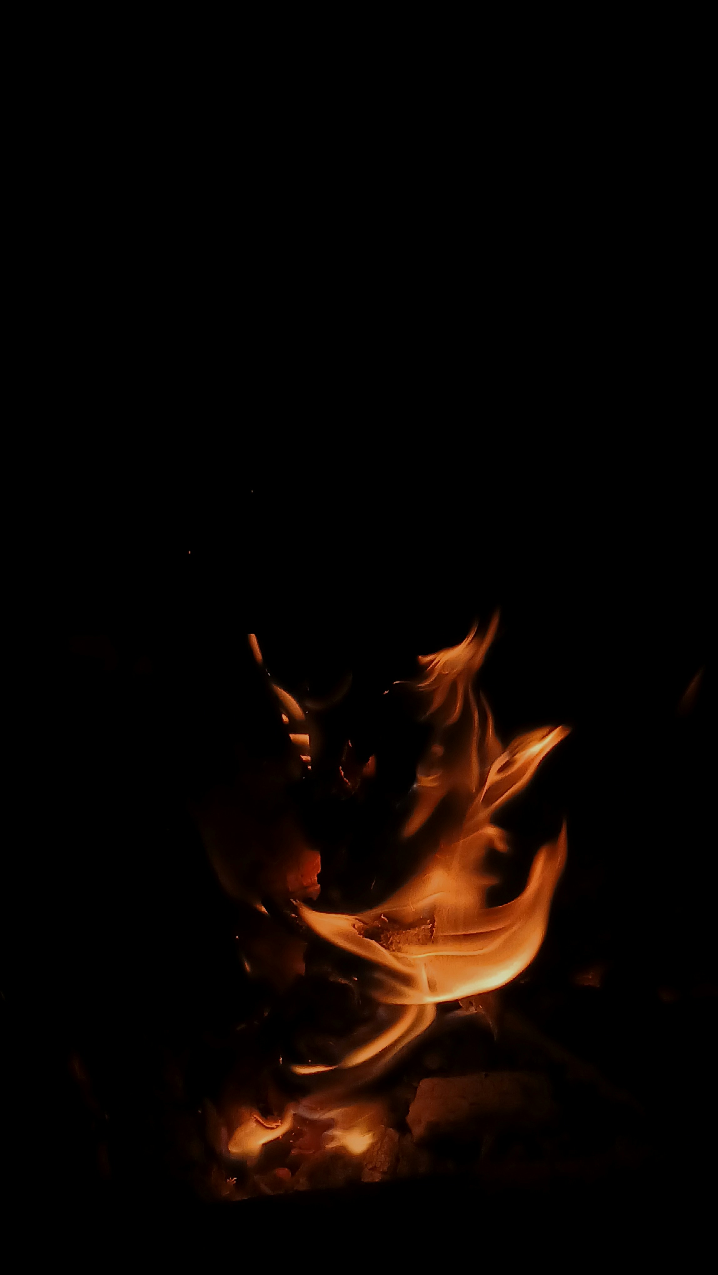 Bright orange flames flickering against a solid black background.