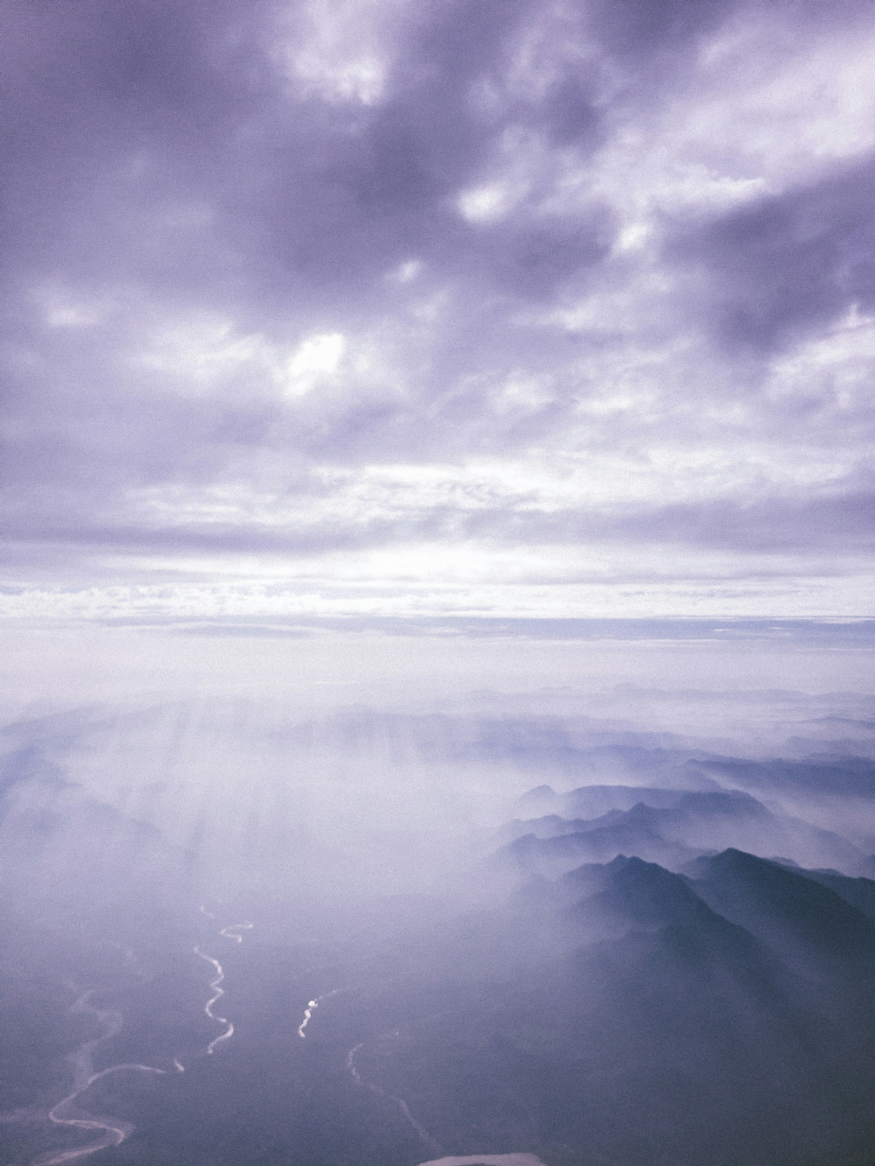 Misted Ridge: Aerial Blue Hour Over Veiled Peaks