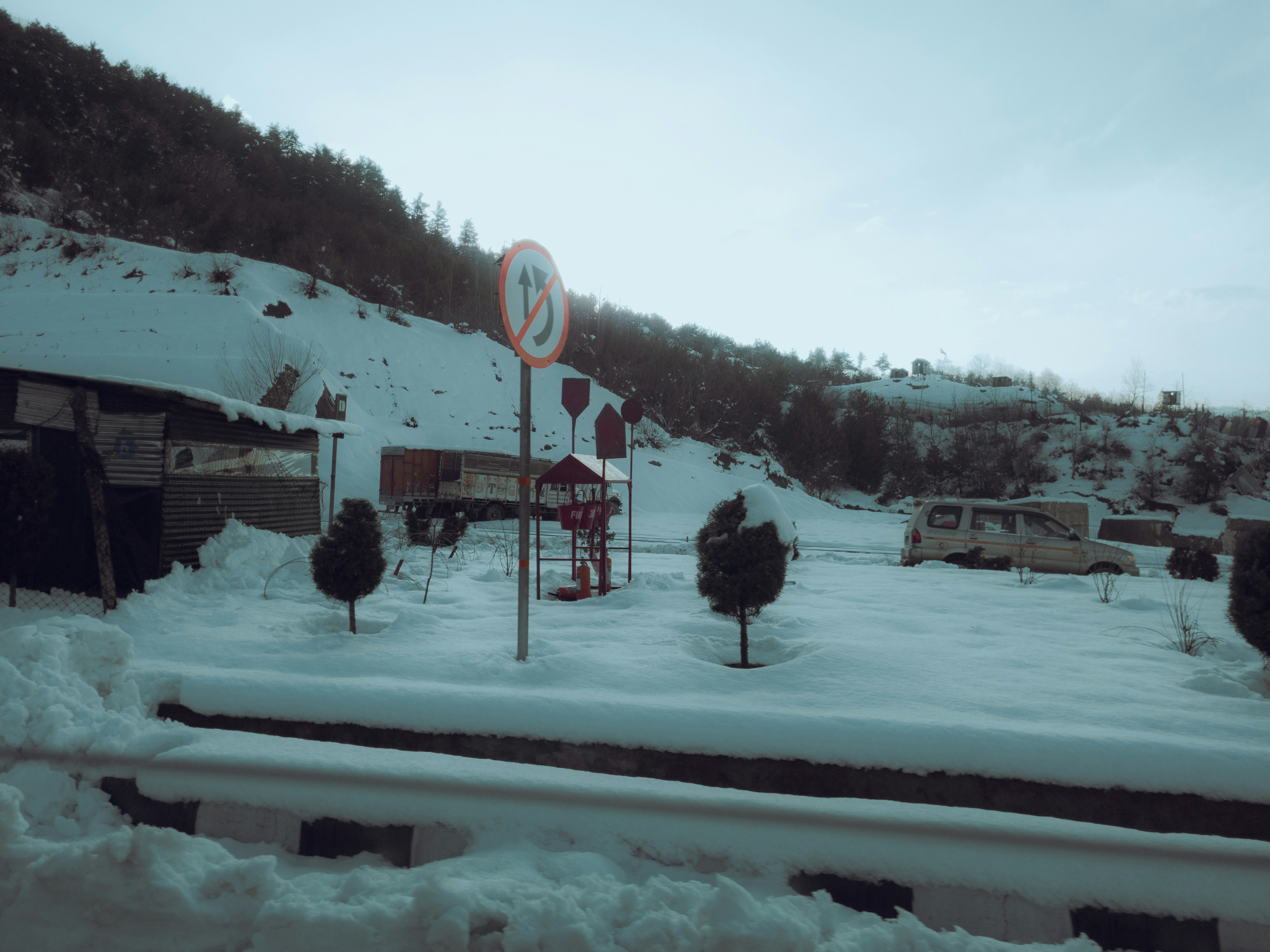 Snow-Covered Streets with Signage and Snow-Pack Borderline Dusk