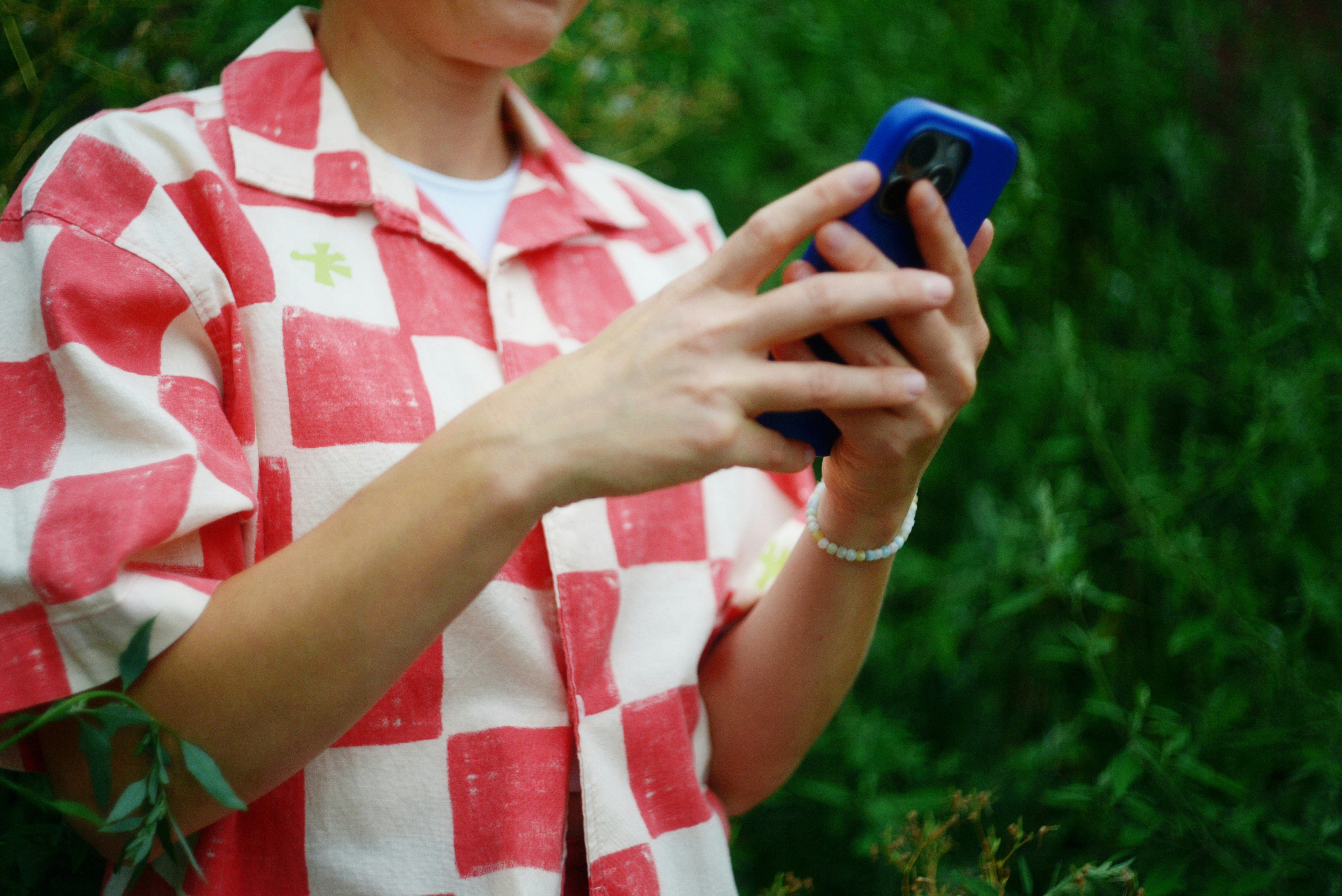 Outstretched Fingers and a Neon Case: Casual Smartphone Moment
