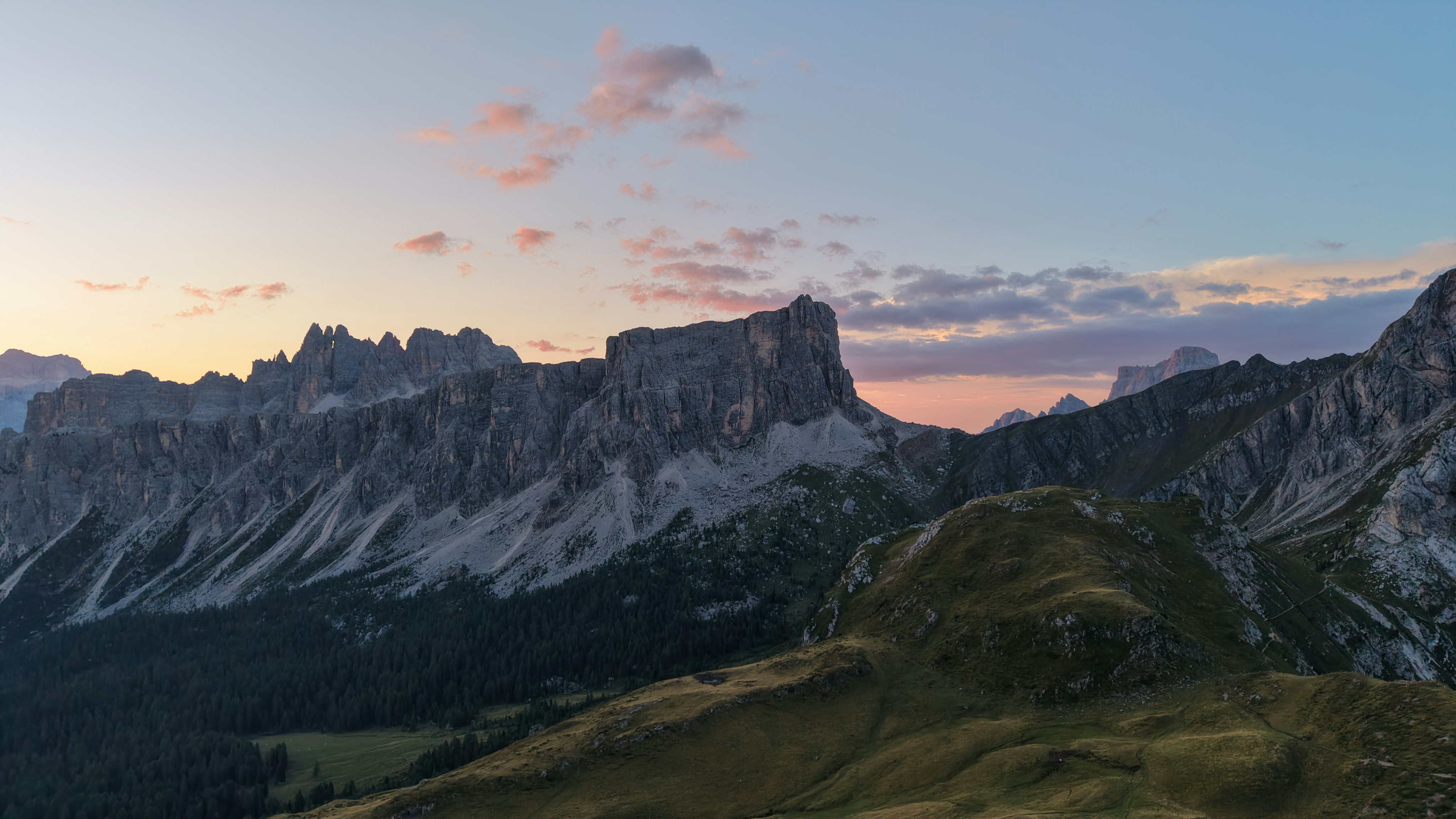 Dawn Silhouettes Over Alpine Ridges