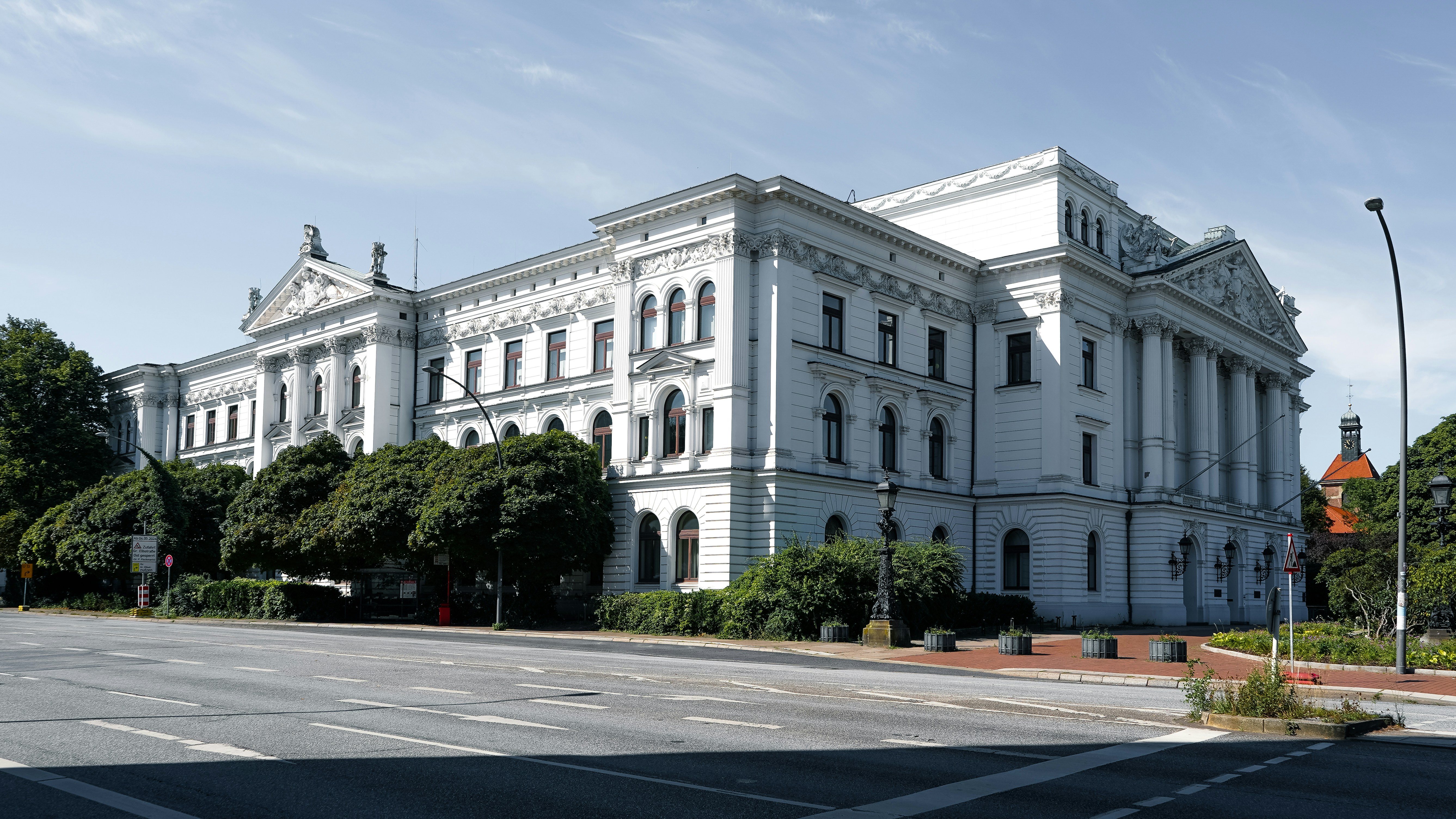 Grand Neoclassical Facade: A White Landmark Soaring Over a Quiet Boulevard