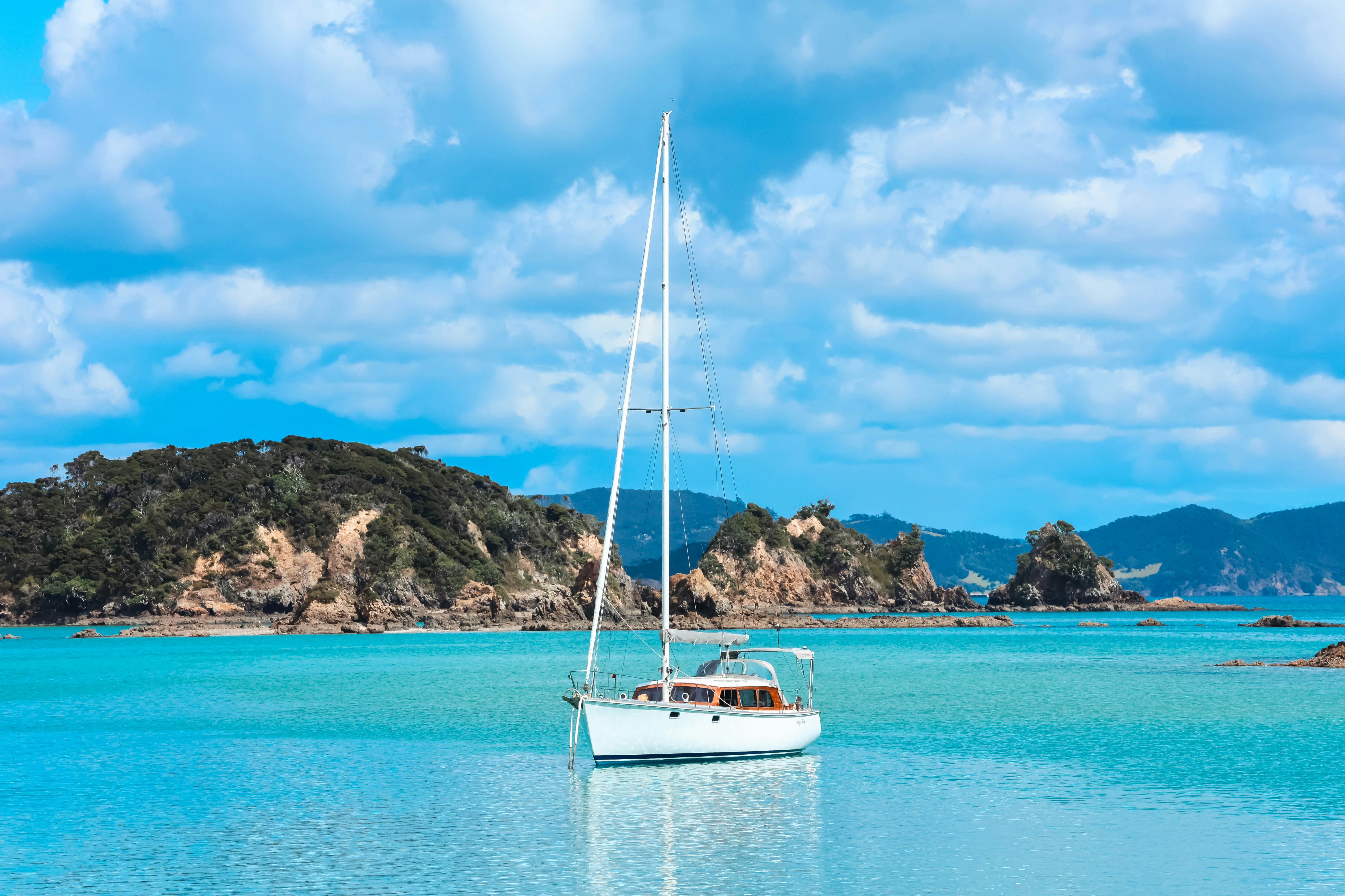 Silent Sailboat Drifting on Turquoise Stillness