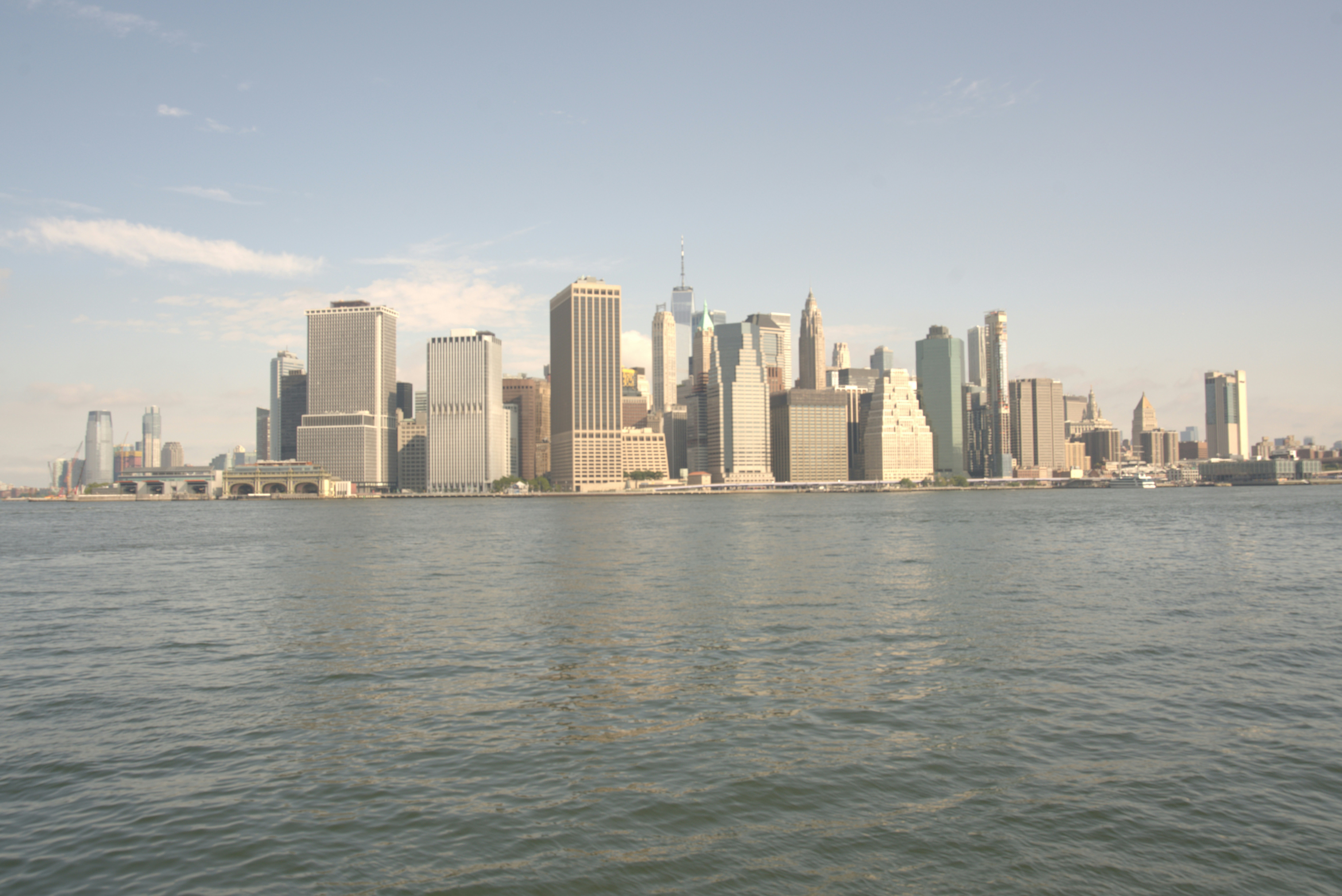 City silhouette across the harbor at golden-hour light