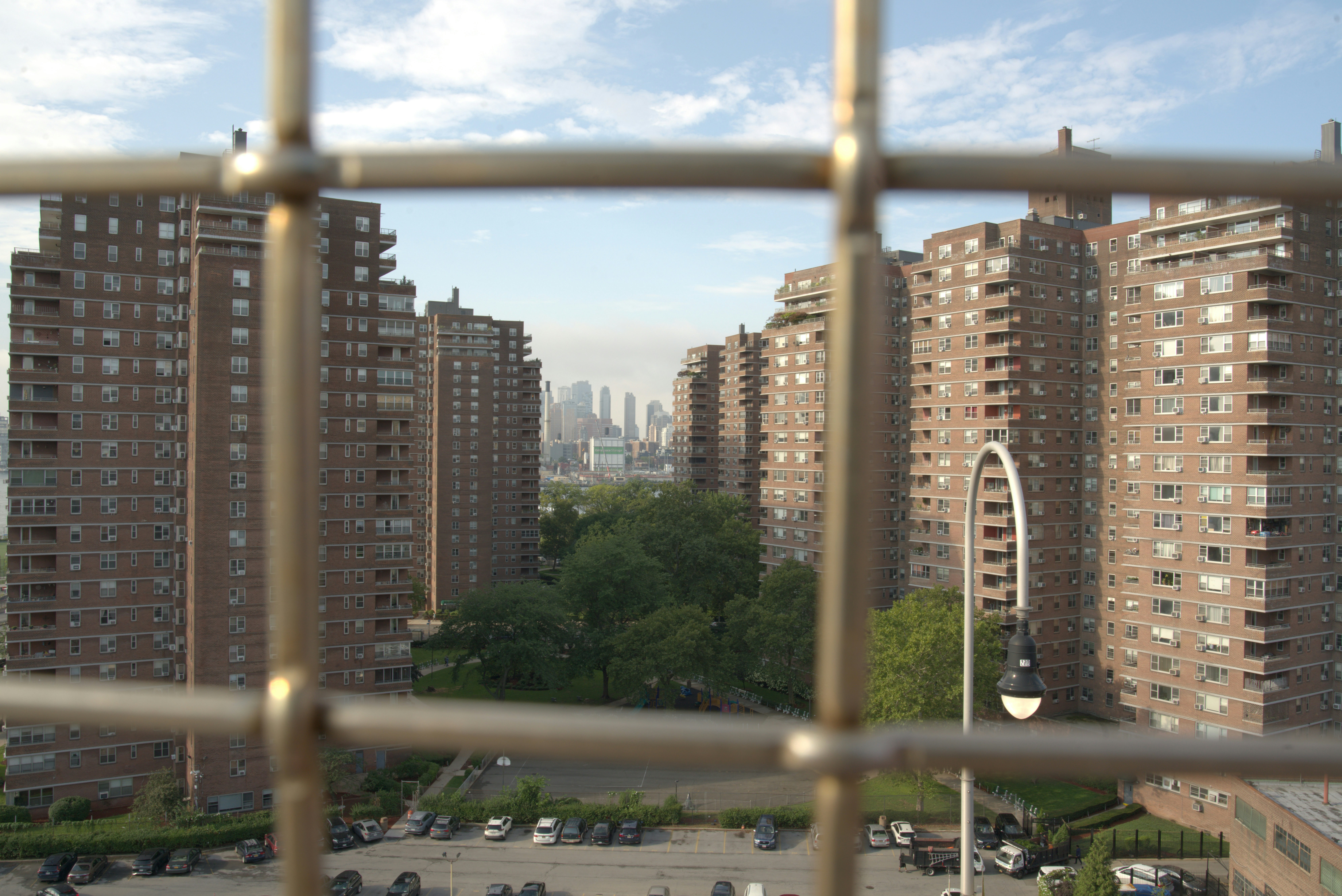 Urban Gridthrough: A City Gap Framed by Window Rails