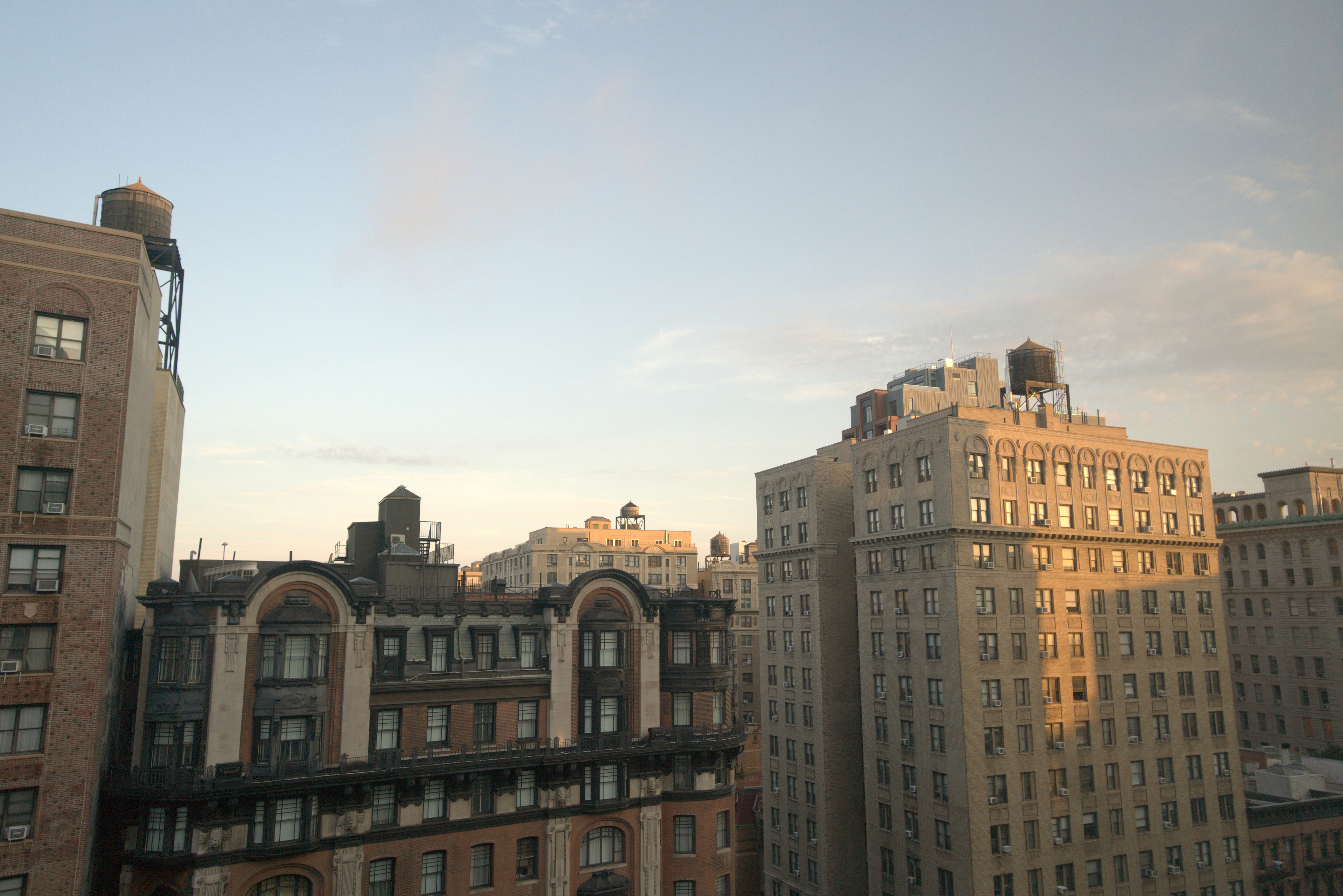 Urban Sunrise: Facades Exhaling Light Over a Row of Historic Buildings