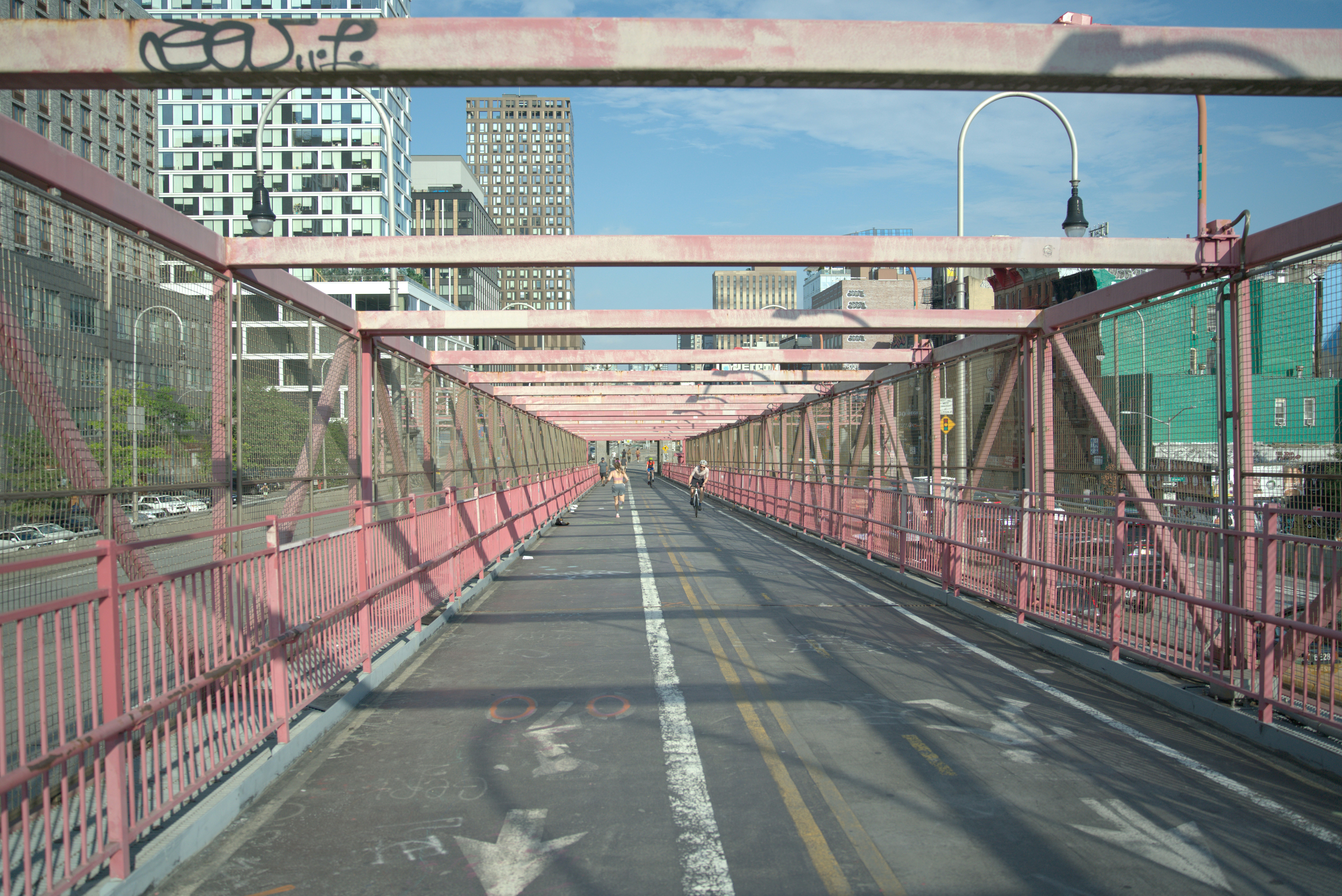 Perspective on a Pink-Fenced City Bridge