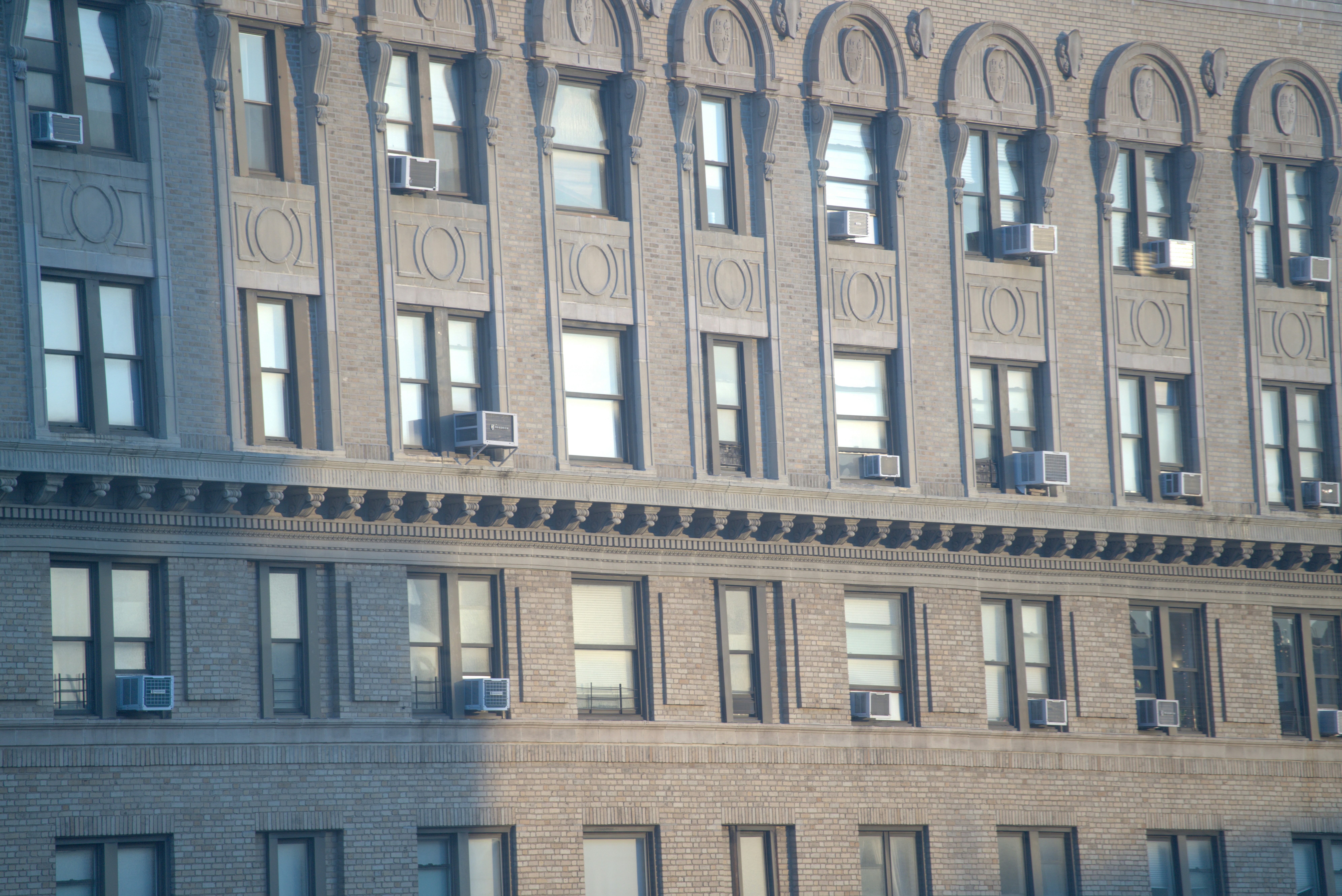 Brickwork Echoes: Repeating Arches and Window Details