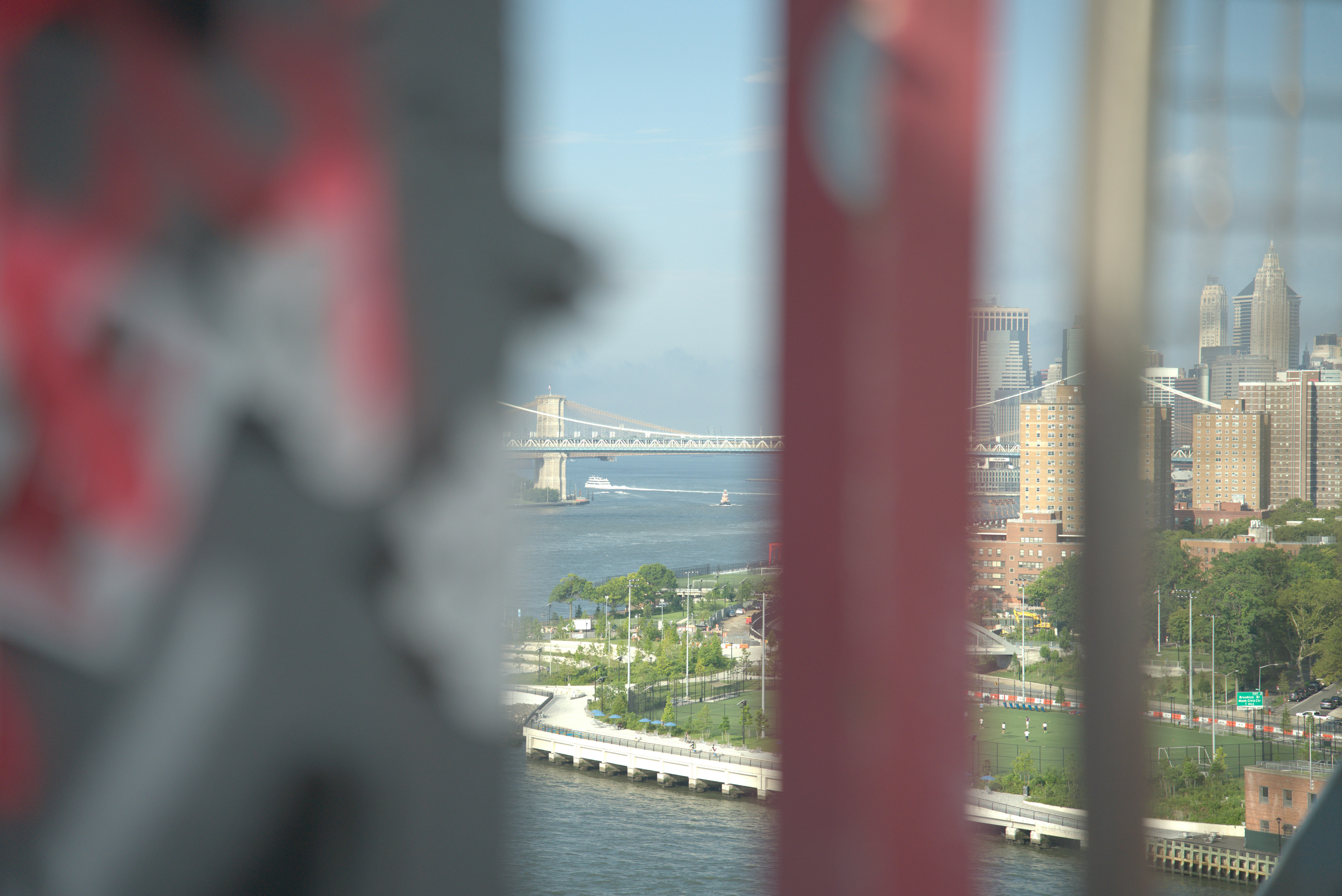 Cityscape Between Slats: A Partial View of the Waterfront and Skyline
