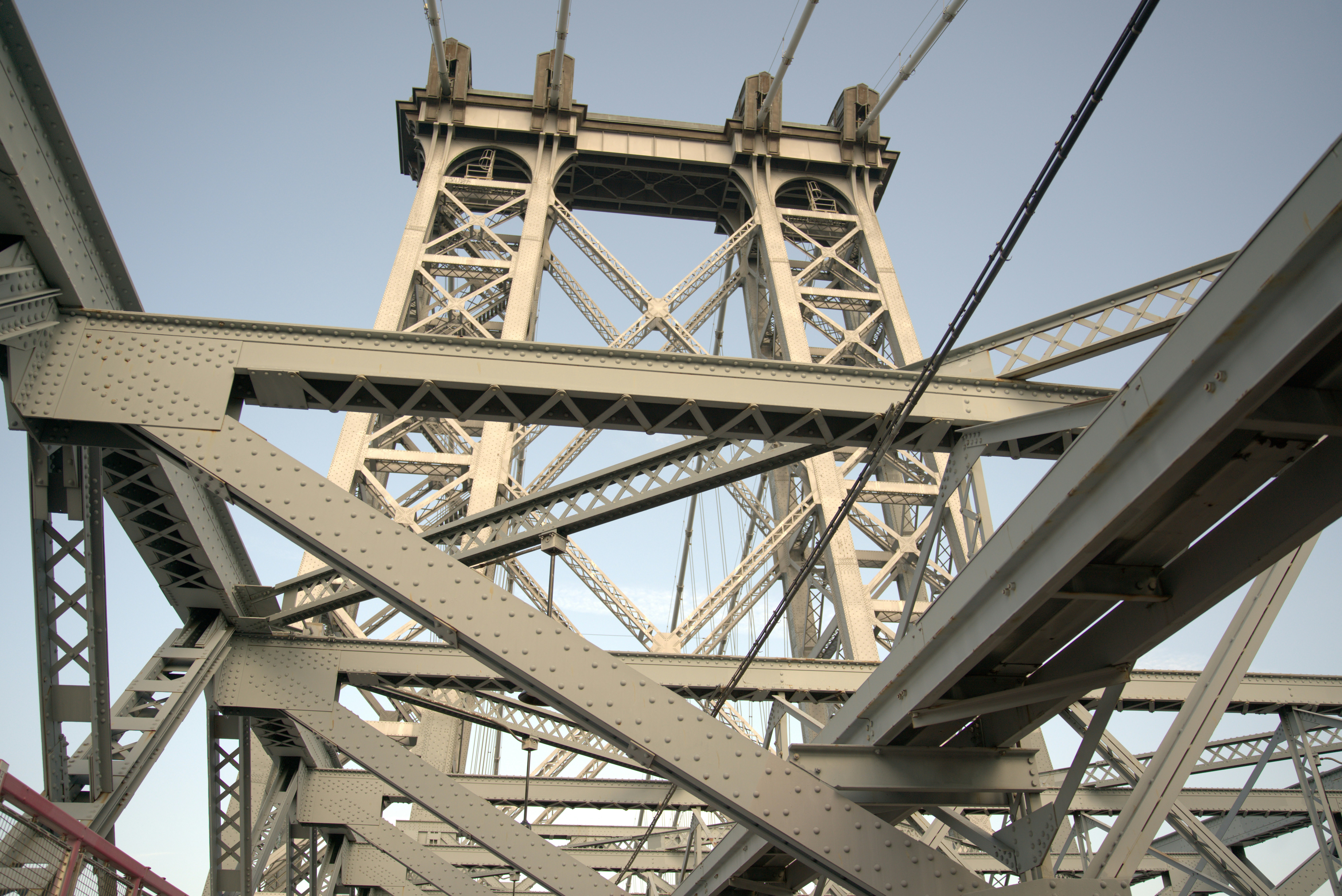 Under the Lattice: A Close-Up of Steel Trusswork and Cables