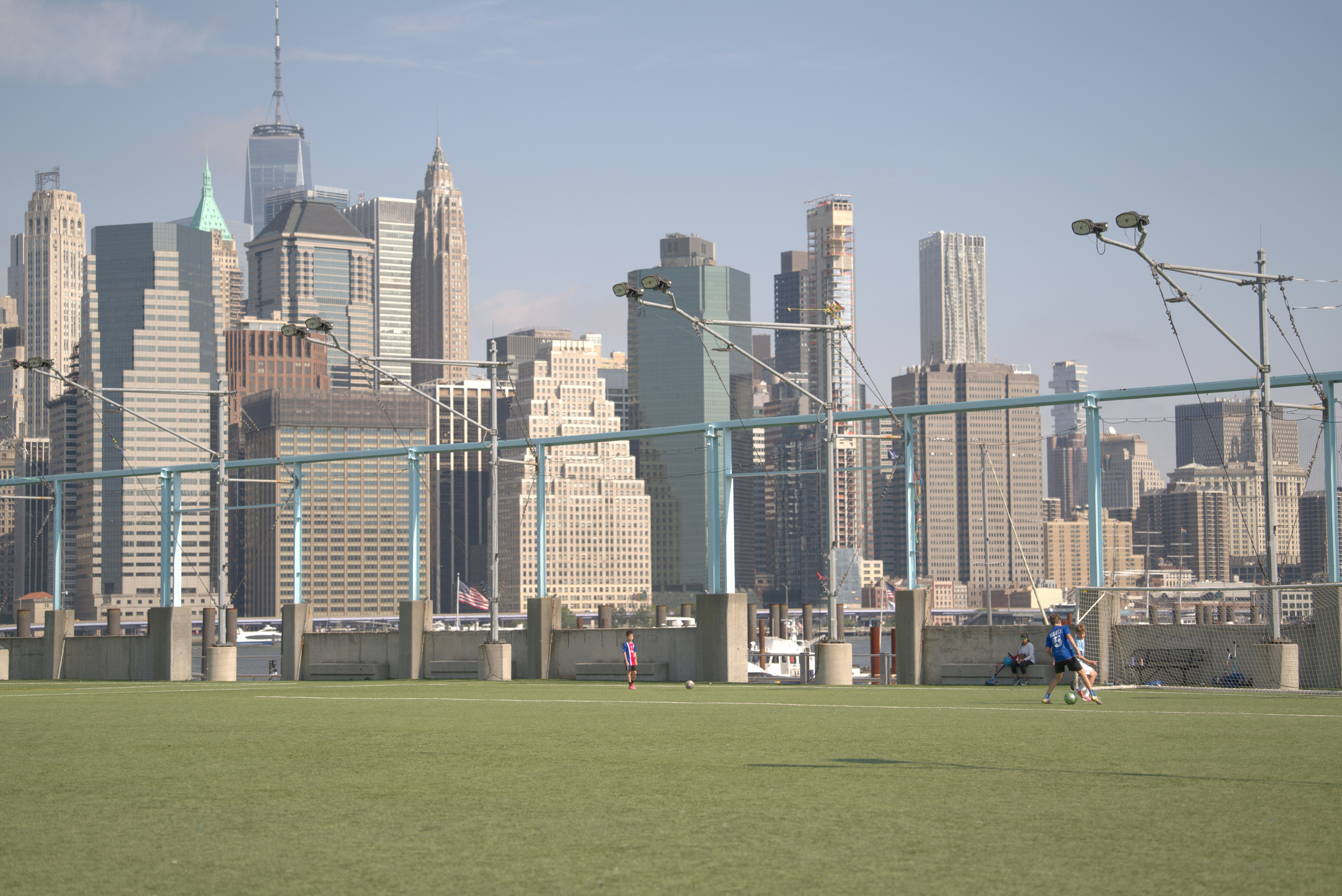 City Skyline Behind a Park Lawn: A Quiet Moment on the Field