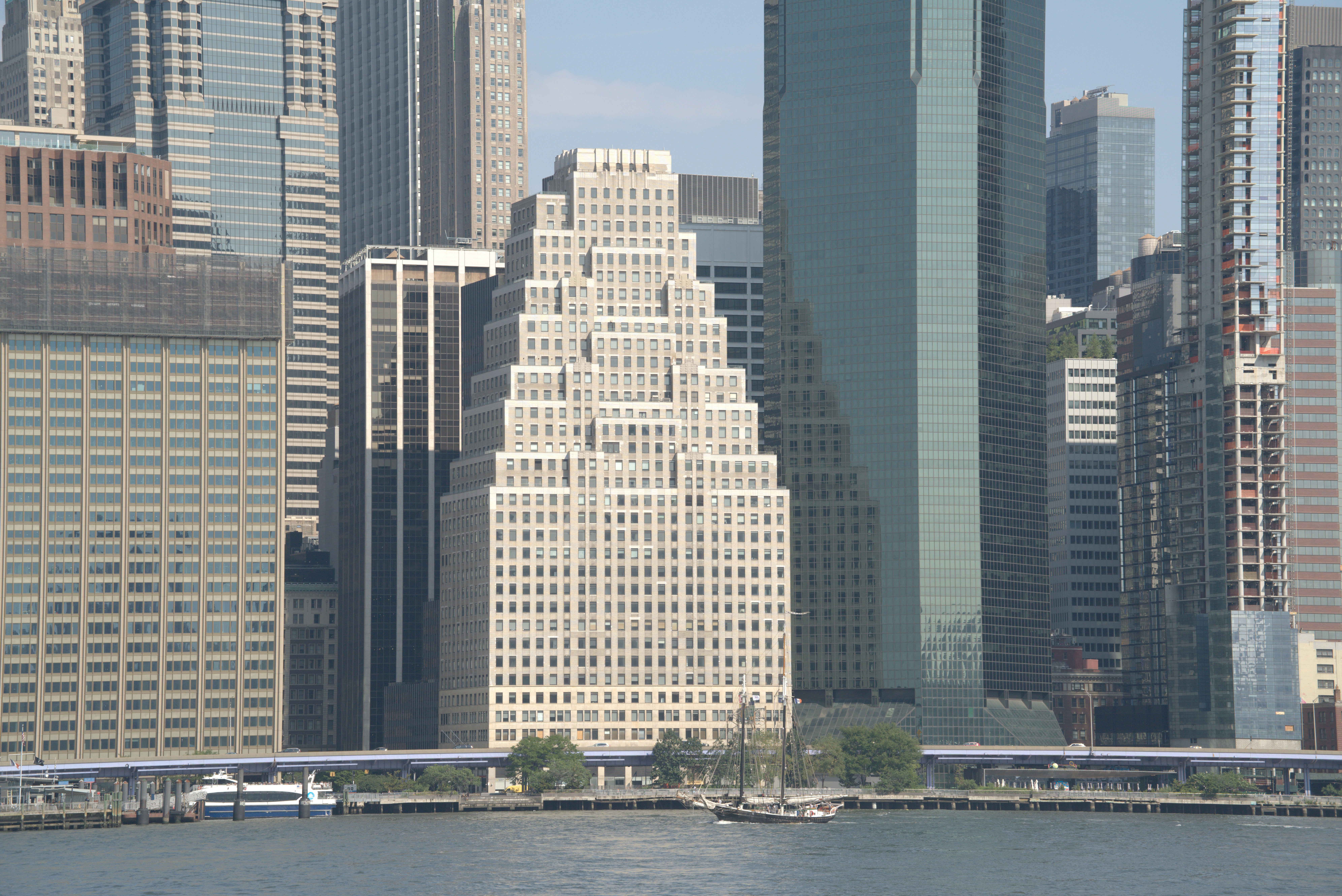 Riverside Skyline: stepped-cliff Corporate Towers by the Water