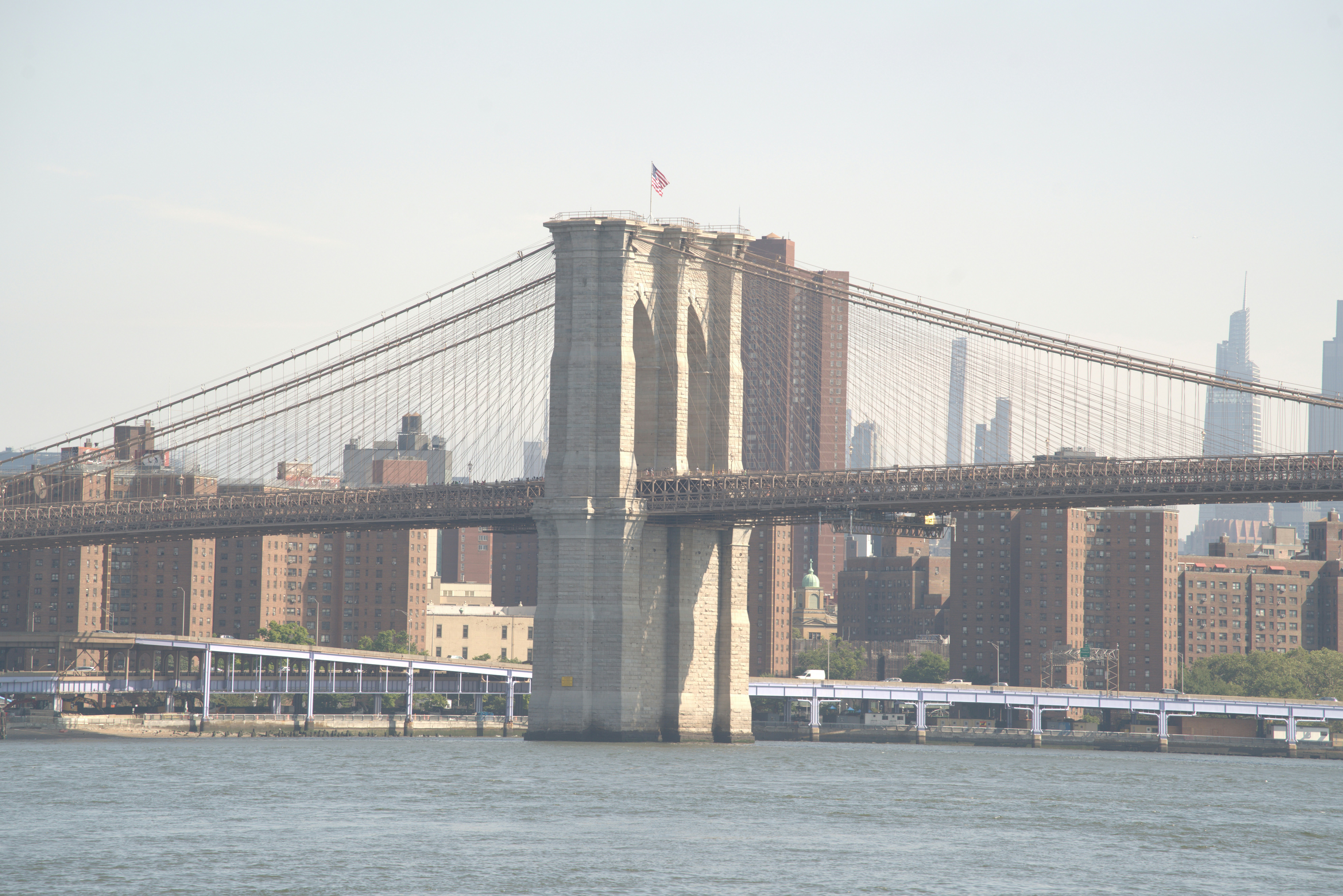 Across the East: Brooklyn Bridge Silhouette Over the River