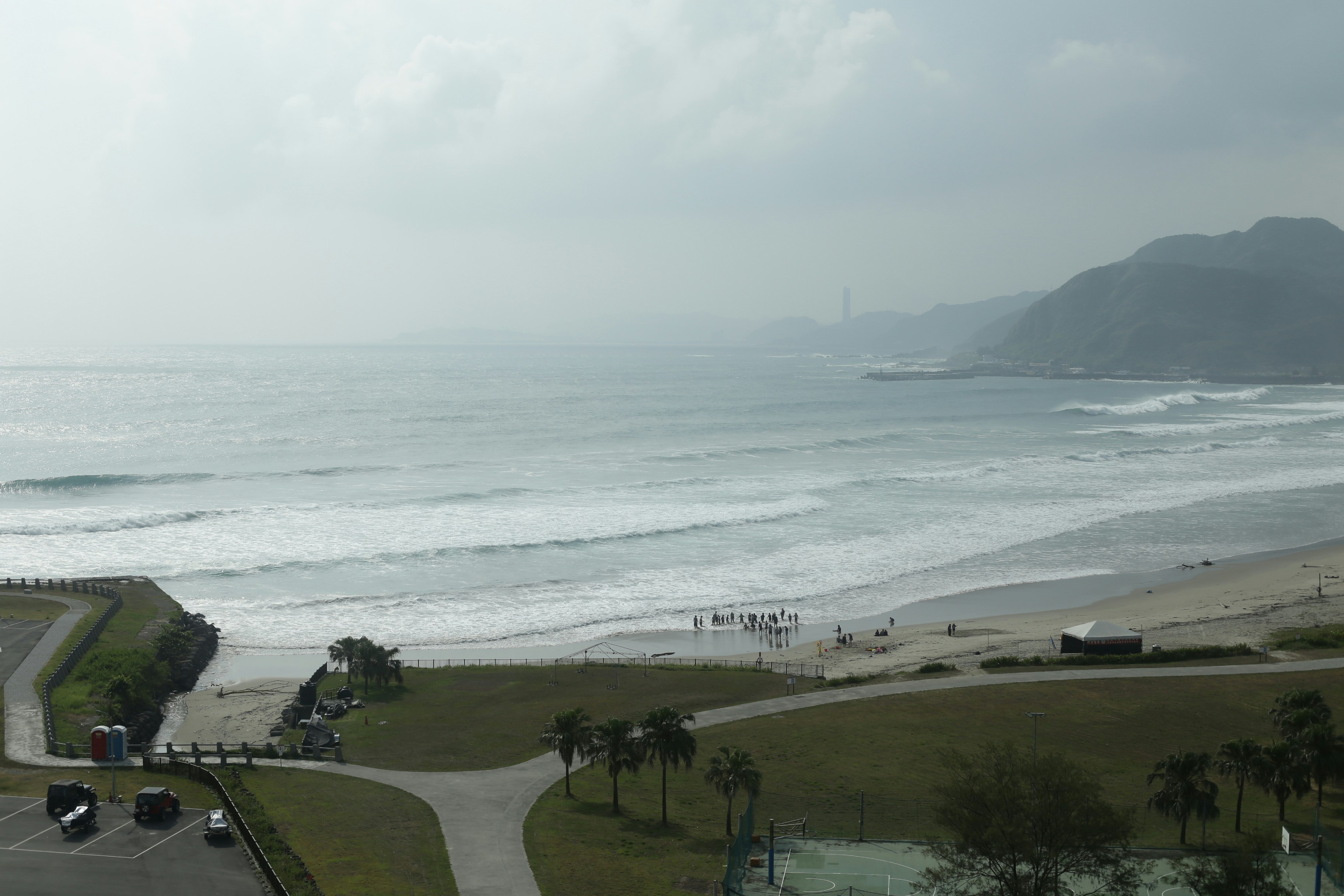 Coastal Park and Distant Sea Ridge Under Soft Morning Light