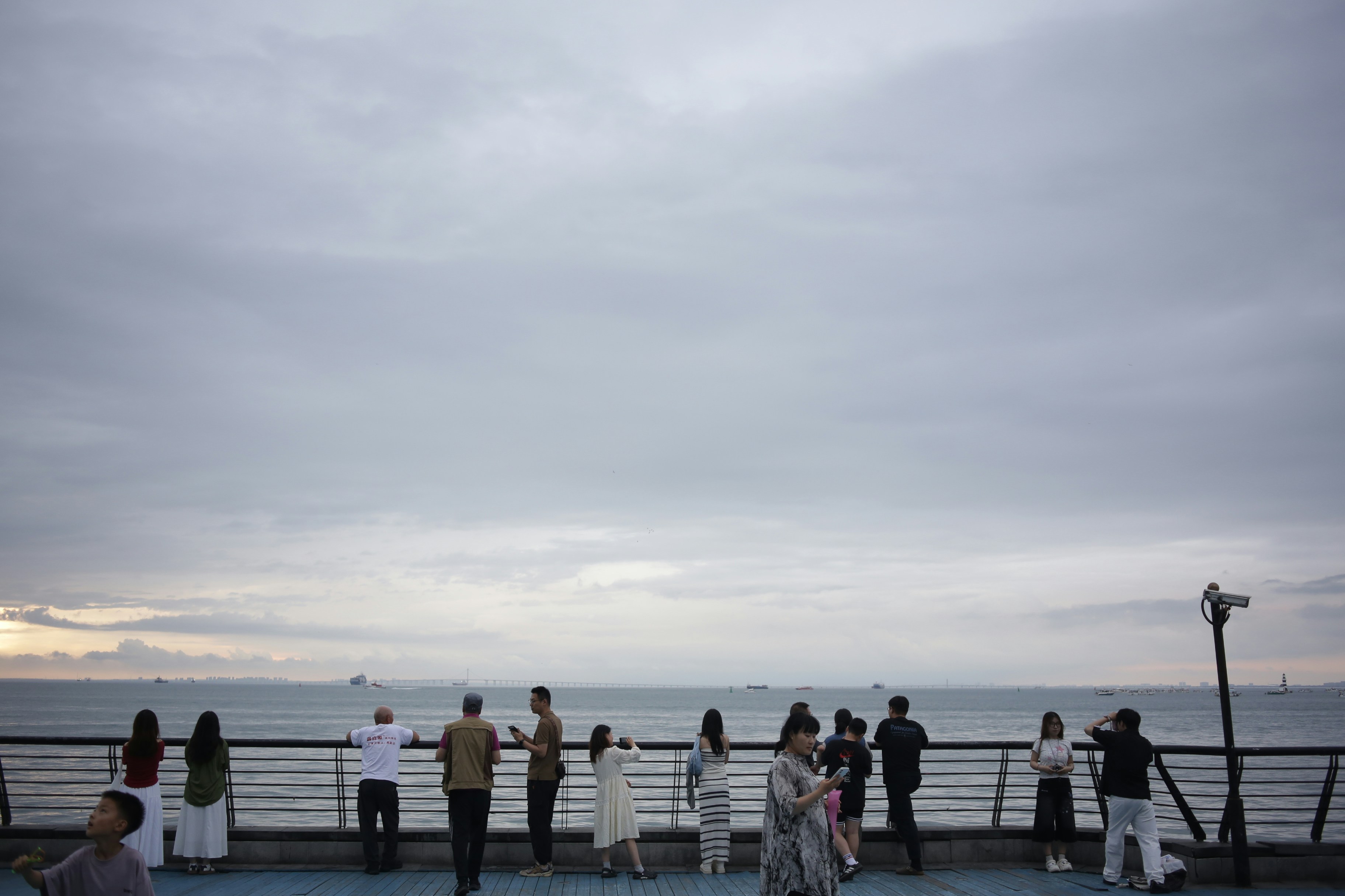 Oceanfront Assembly: Faces at the Rail