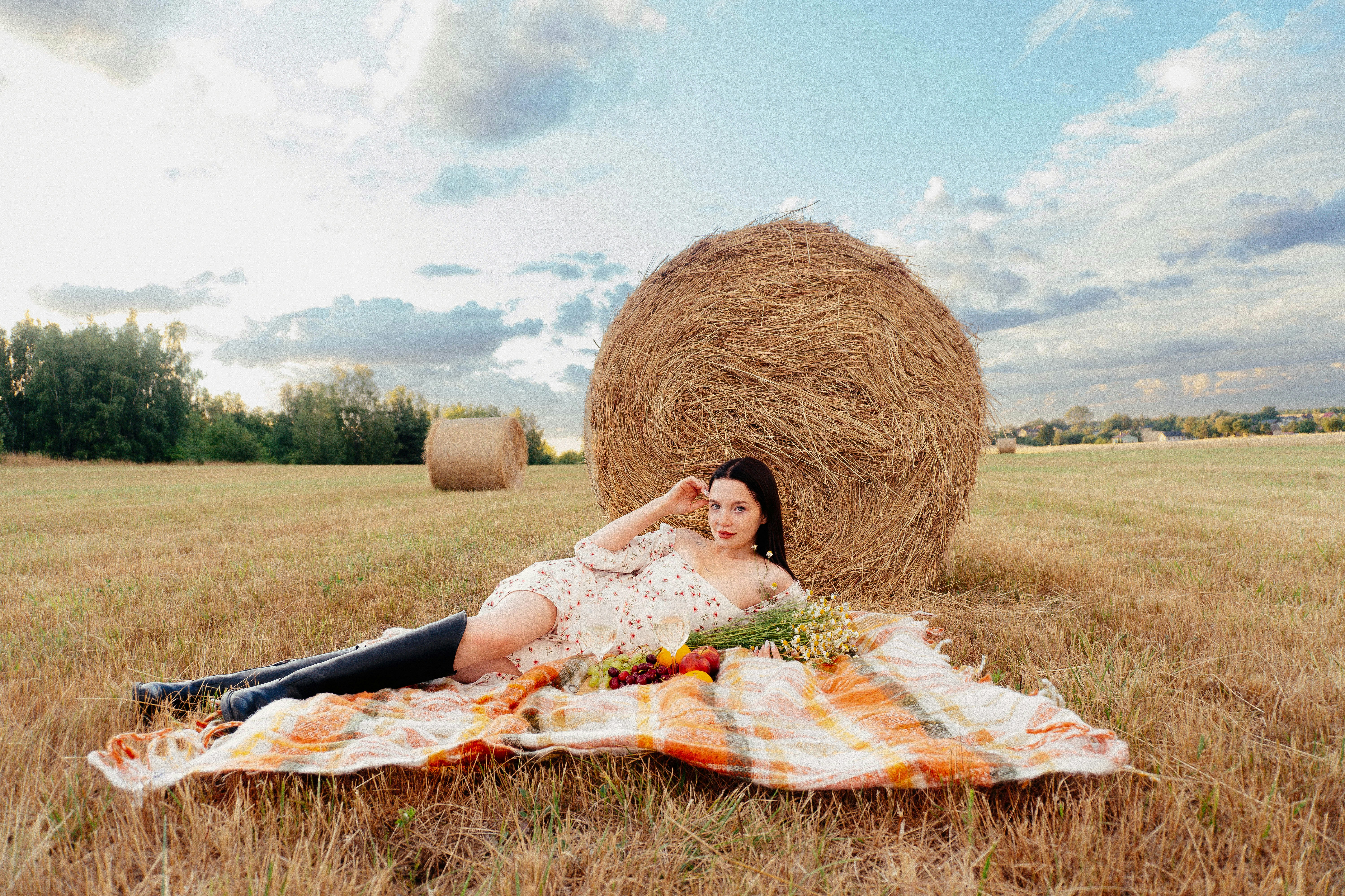 Sunlit Meadow repose beside a cylindrical hay bale