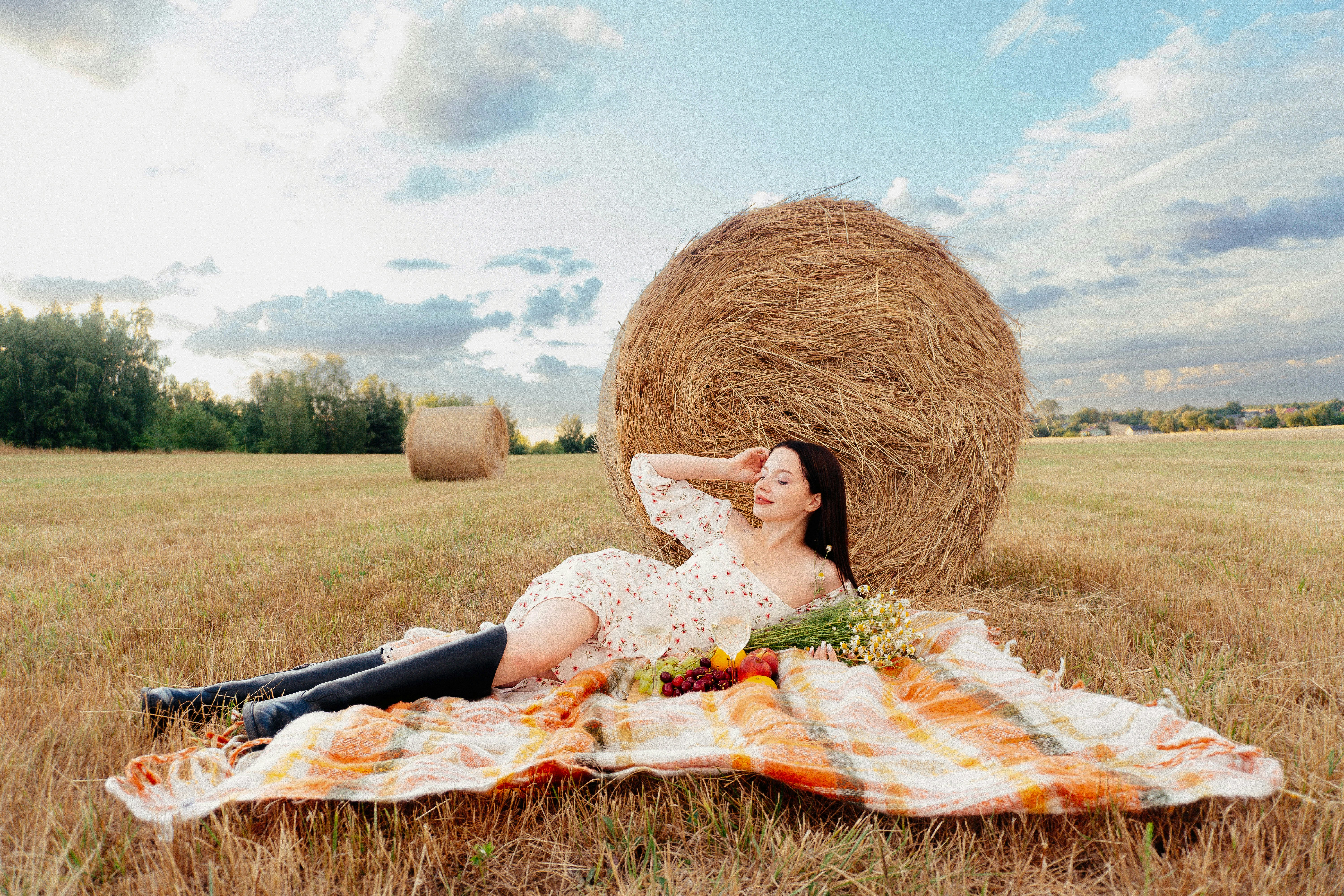 Relaxed Portrait on a Hay Blanket Under Open Skies
