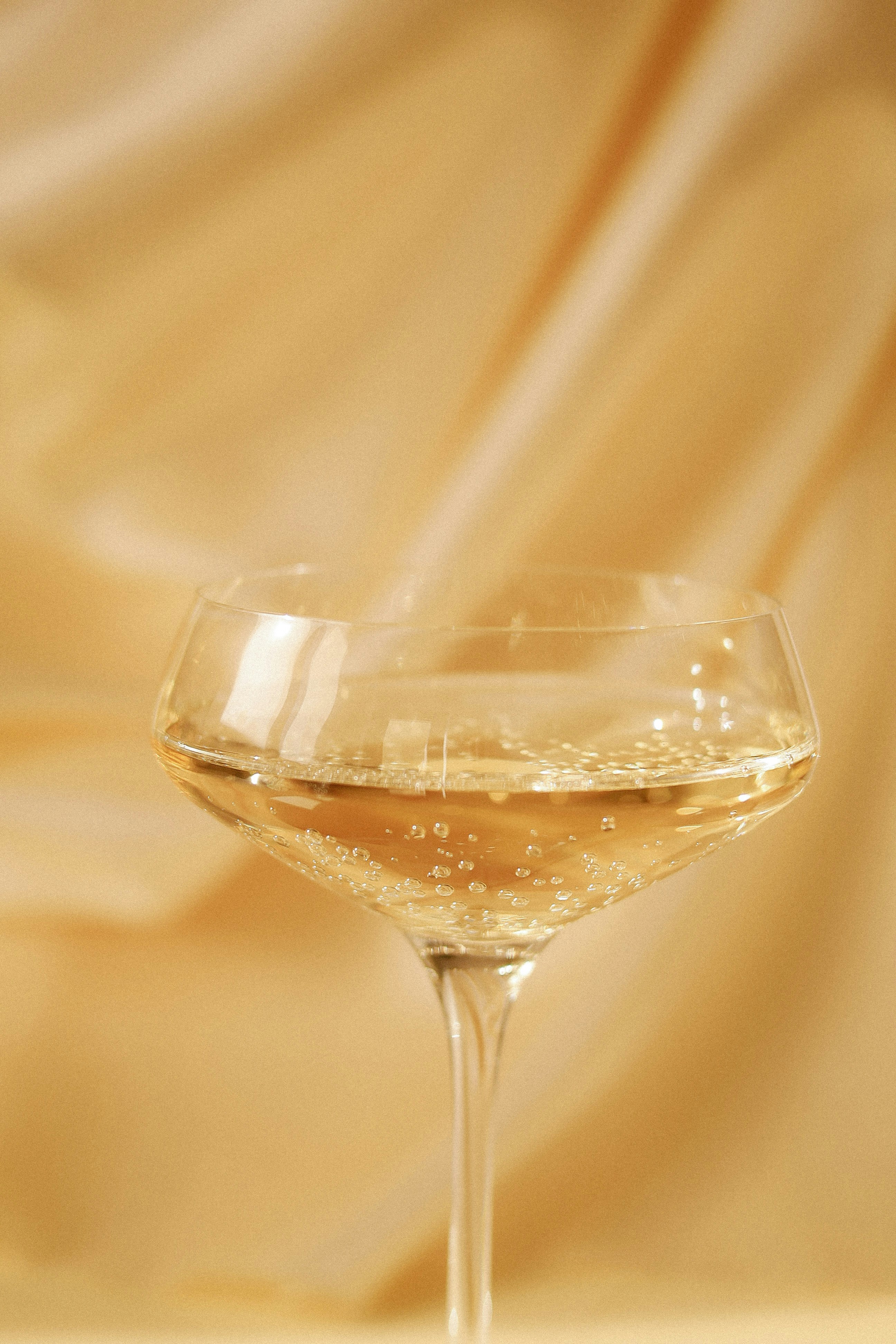 Golden Glass: A Quiet Toast in Warm Light