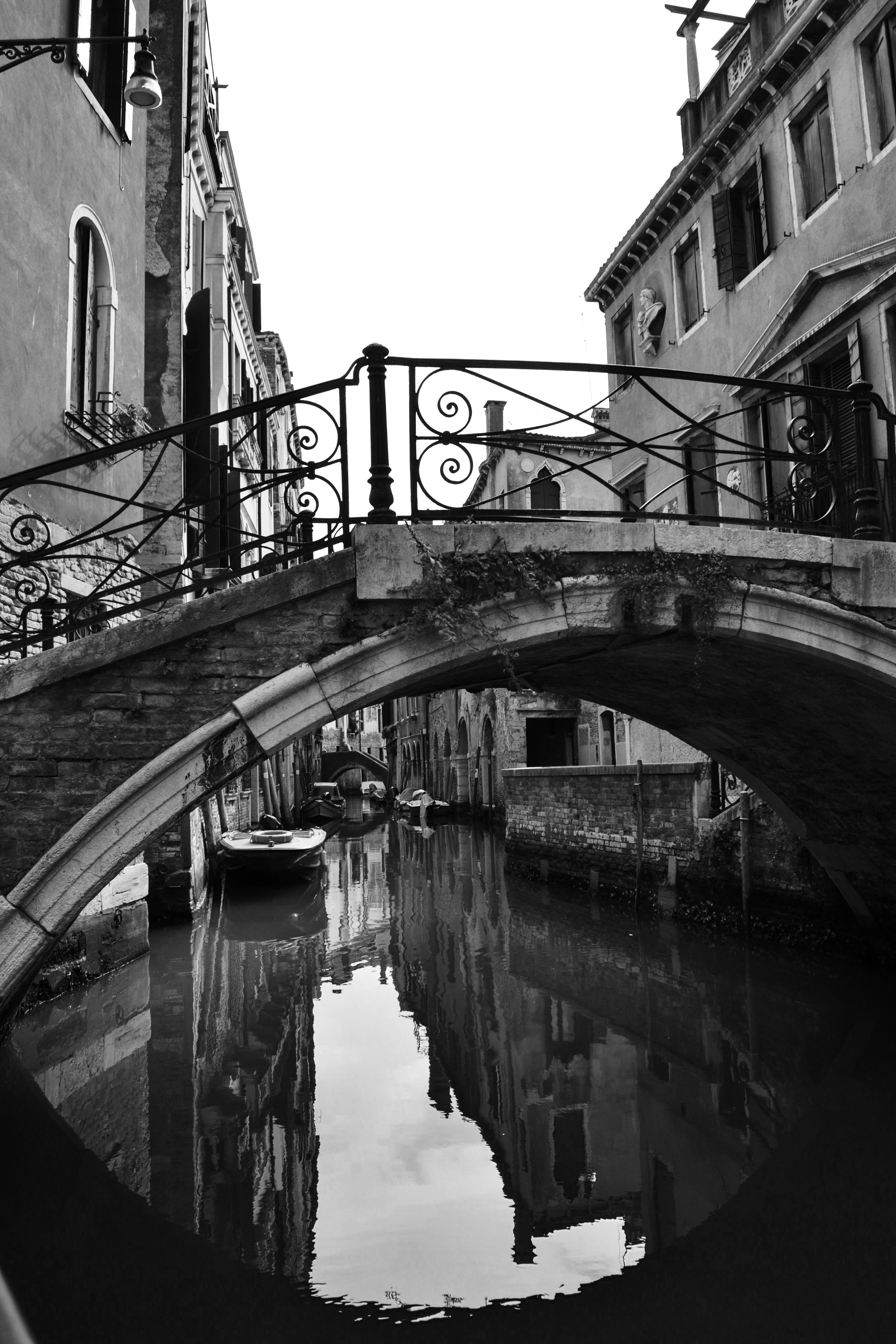 Bridge Arc over a Venetian Canal: Symmetry in Darkness
