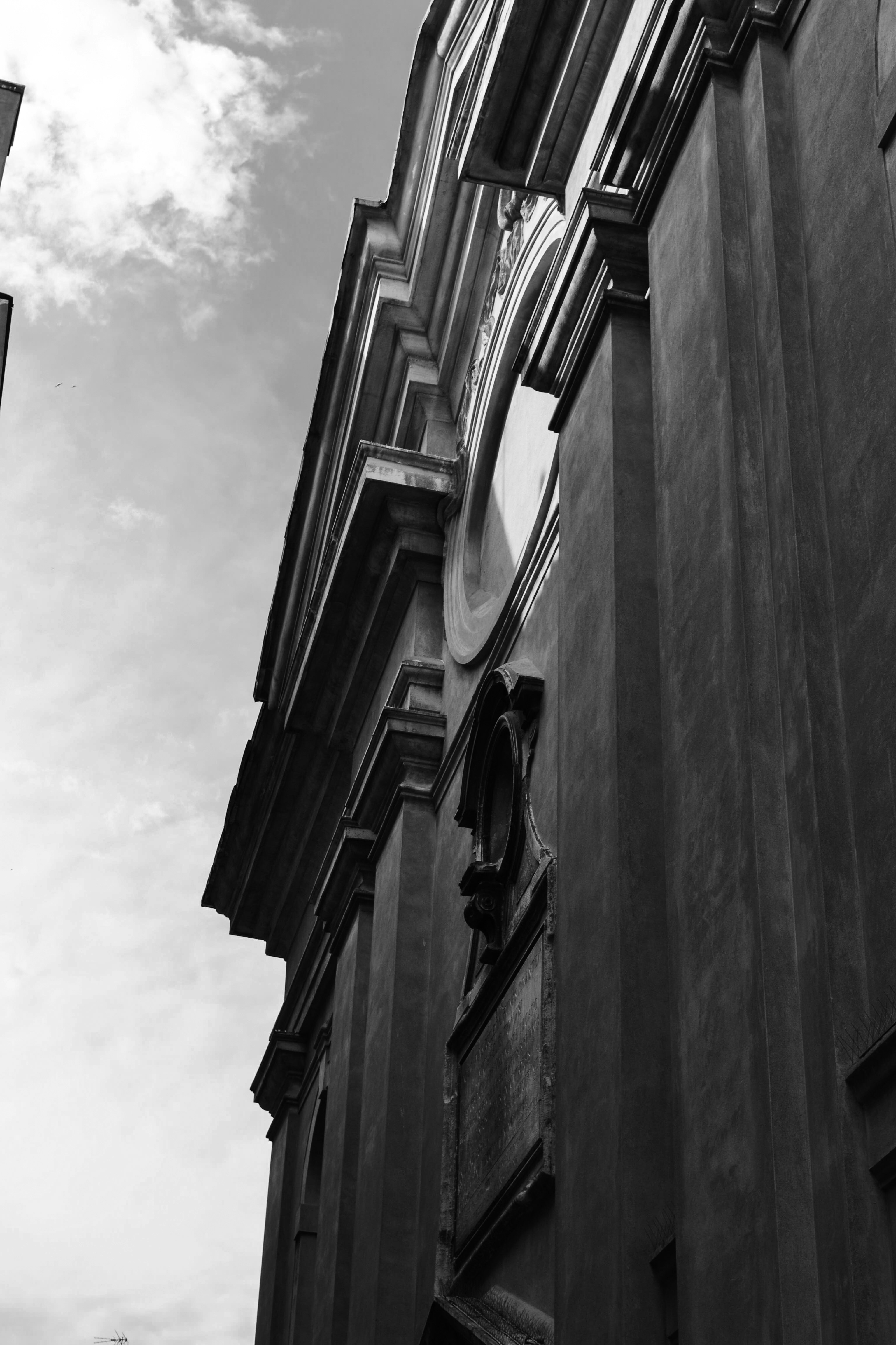 Stone Facade in Monochrome: Architectural Strata Reaching Skyward