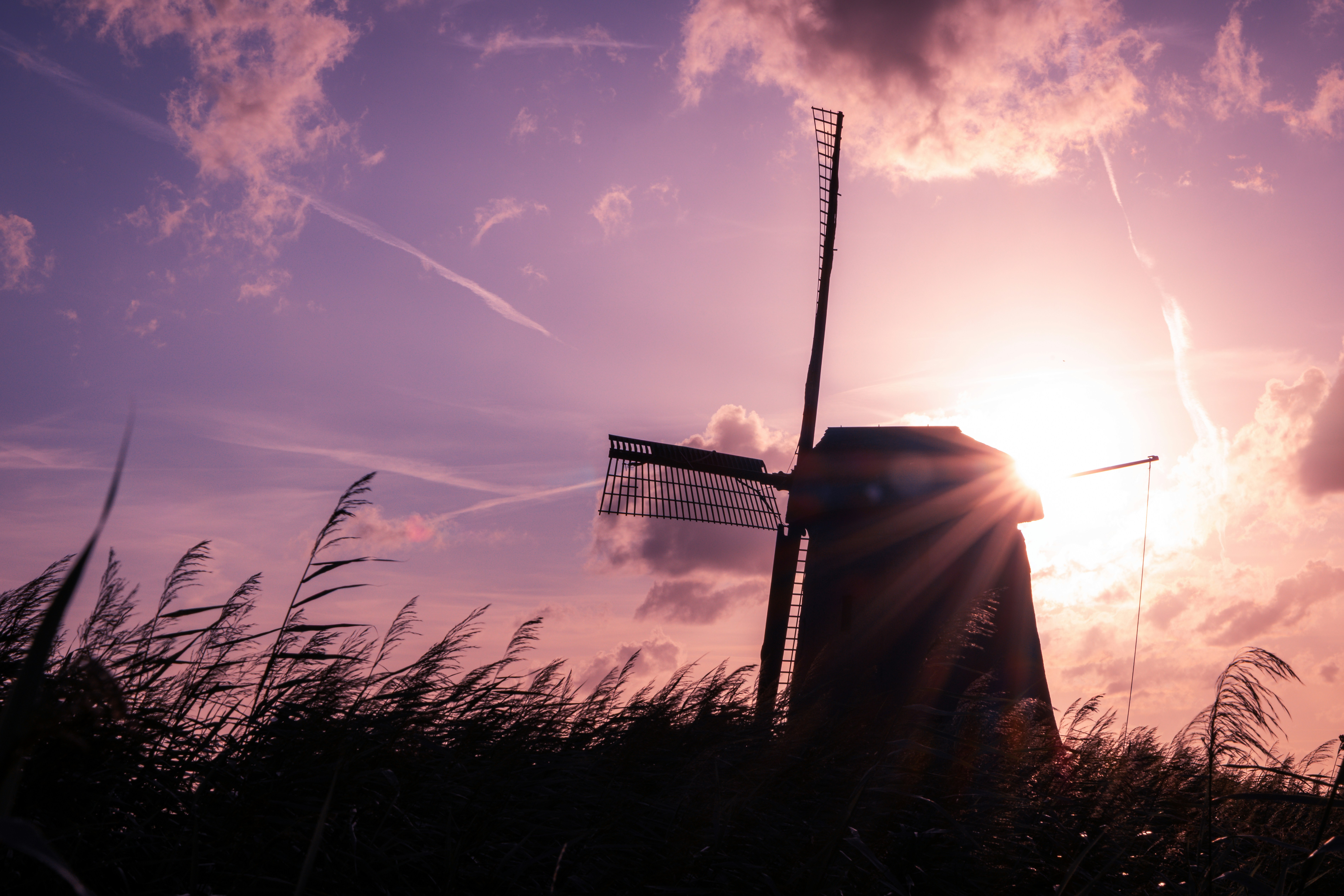 Sunlit Windmill Silhouette at Dusk
