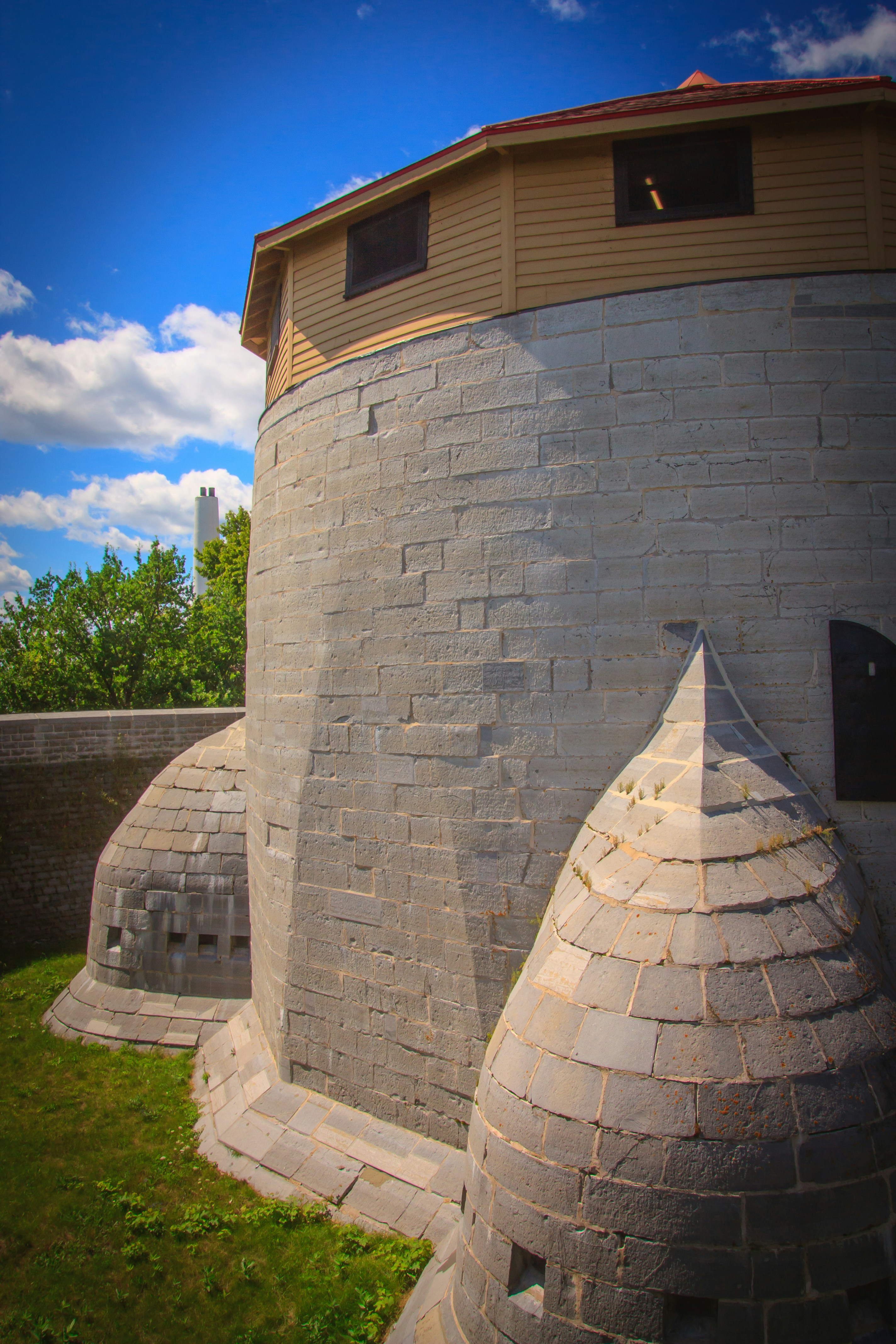 Roundstone Keep: Stone Turret Rising Under a Blue Sky