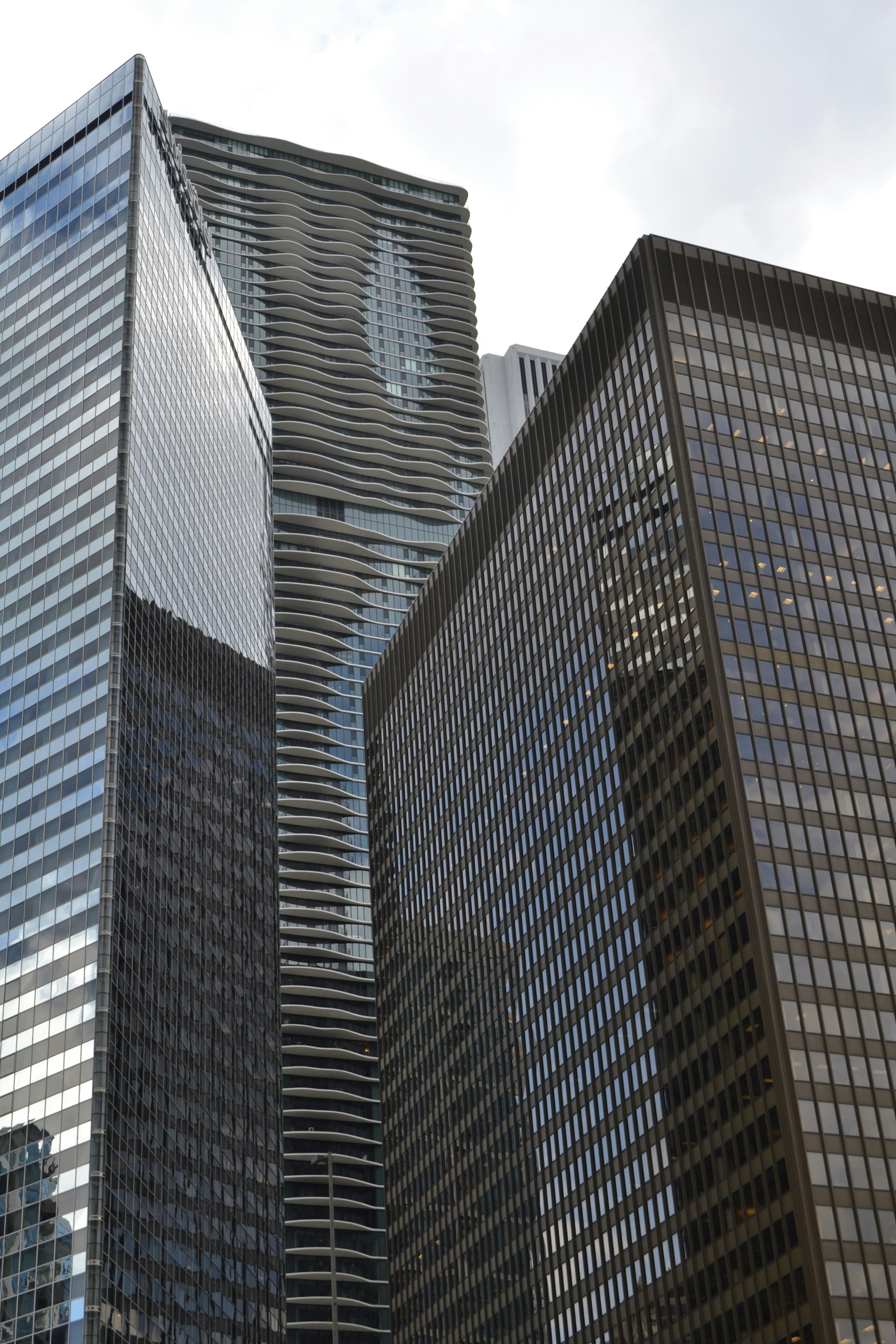 Skyscraper Symphony: A Vertical Convergence of Glass and Wave-Lined Facades