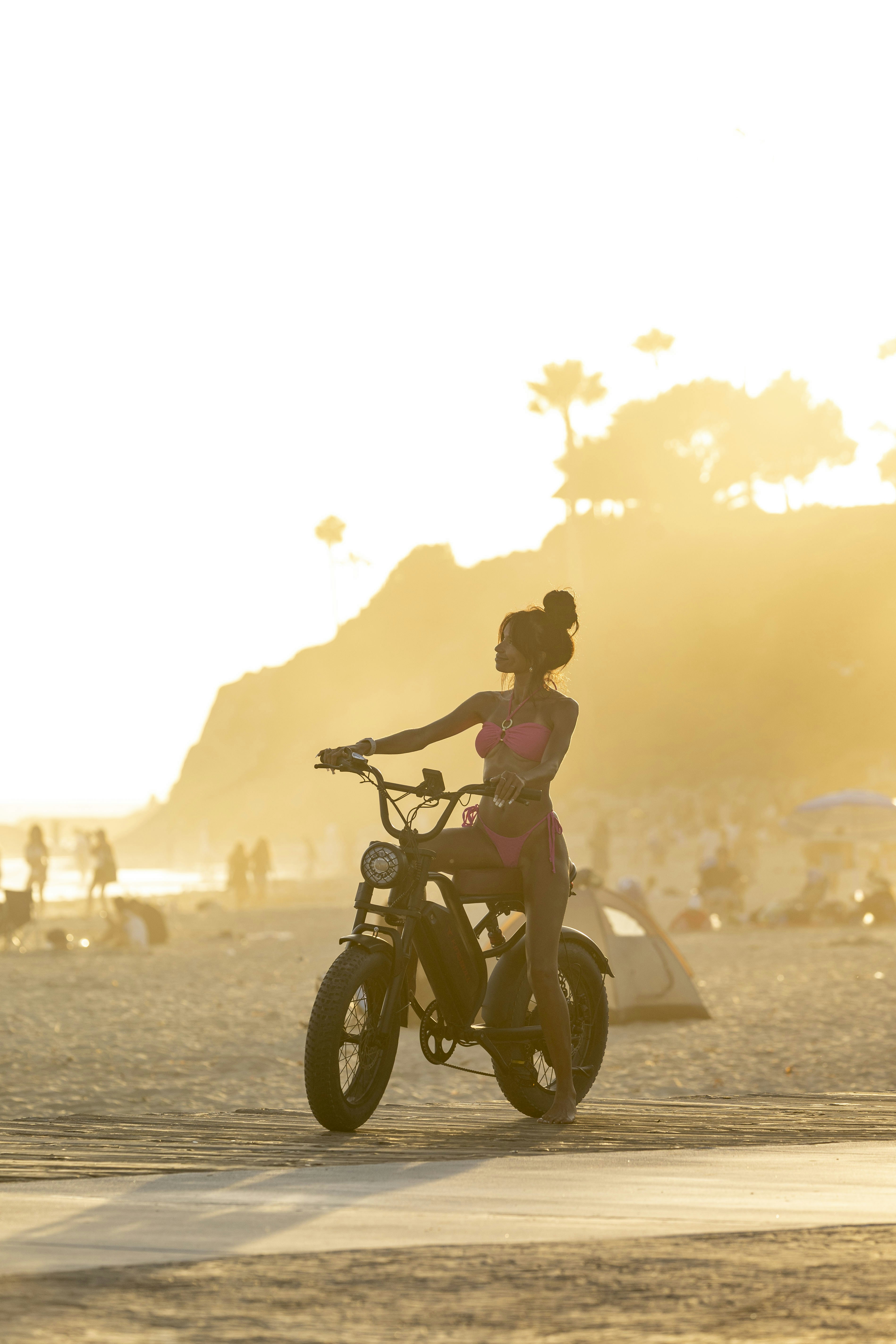 Sunlit Rider: A Bikini-Clad Moment on the Beach Bike