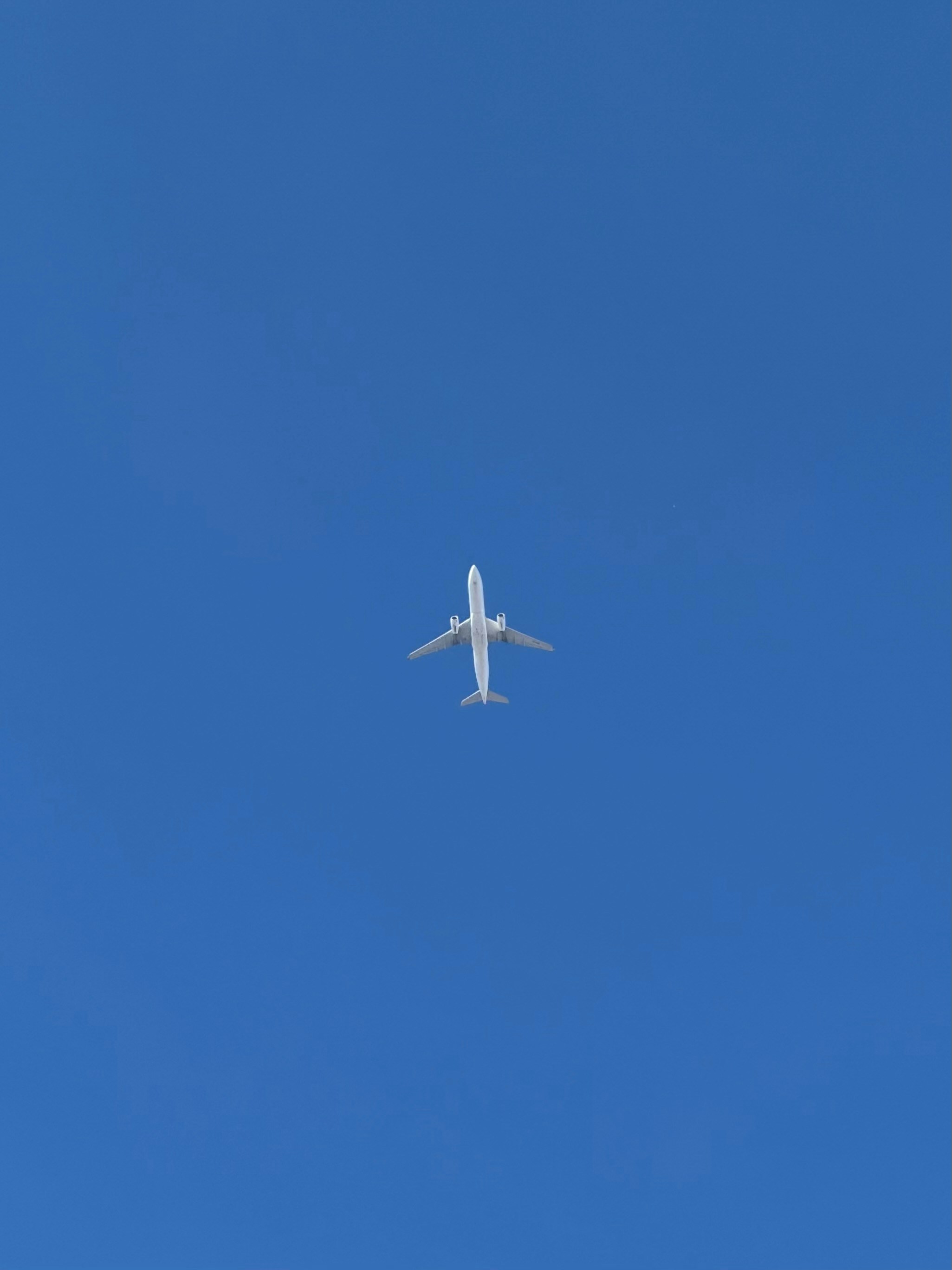 Midair Silhouette: A Quiet Climb Against a Vast Blue Sky