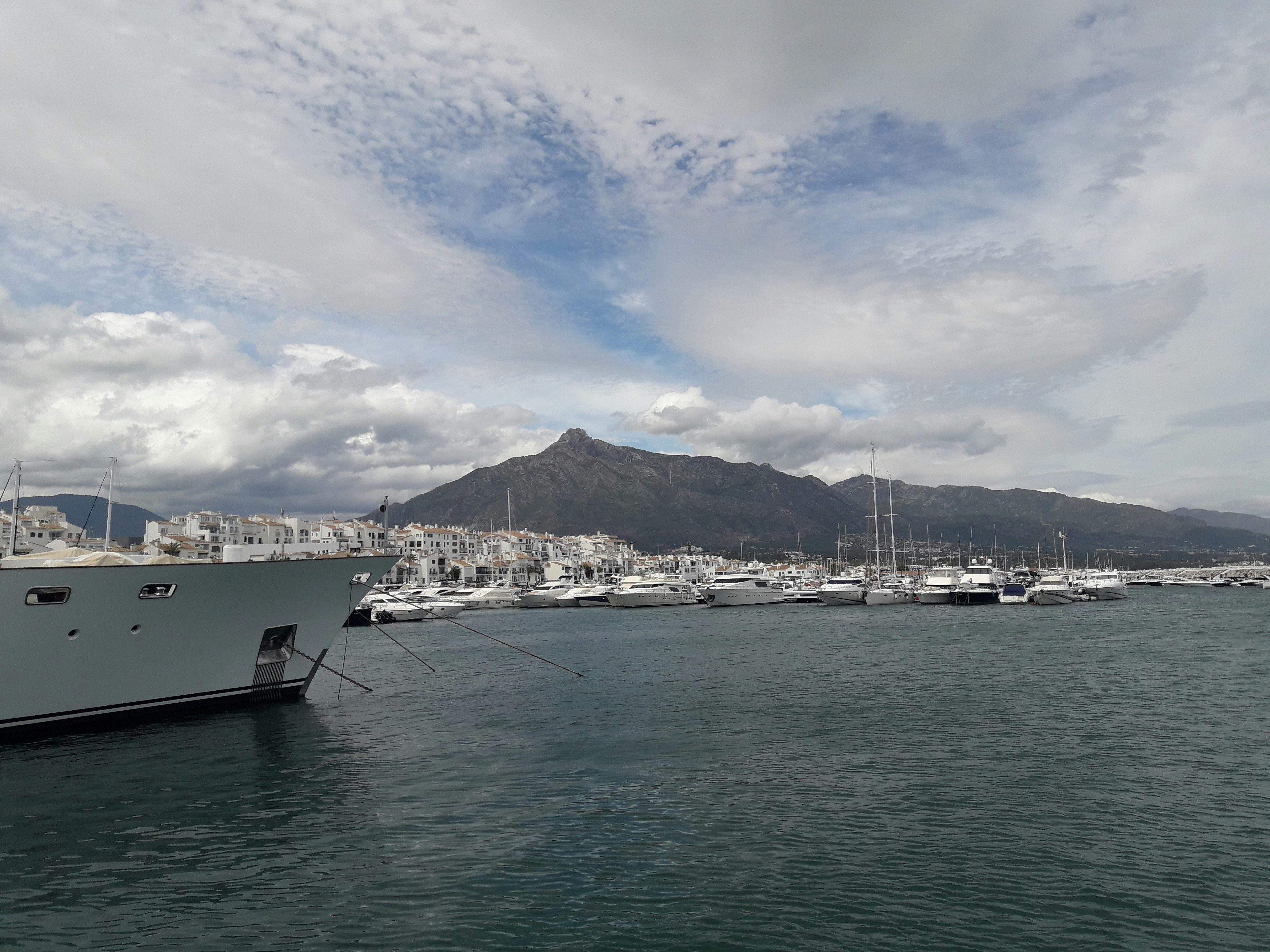 Harbor Majesty: Yachts at Rest with Mountain Backdrop