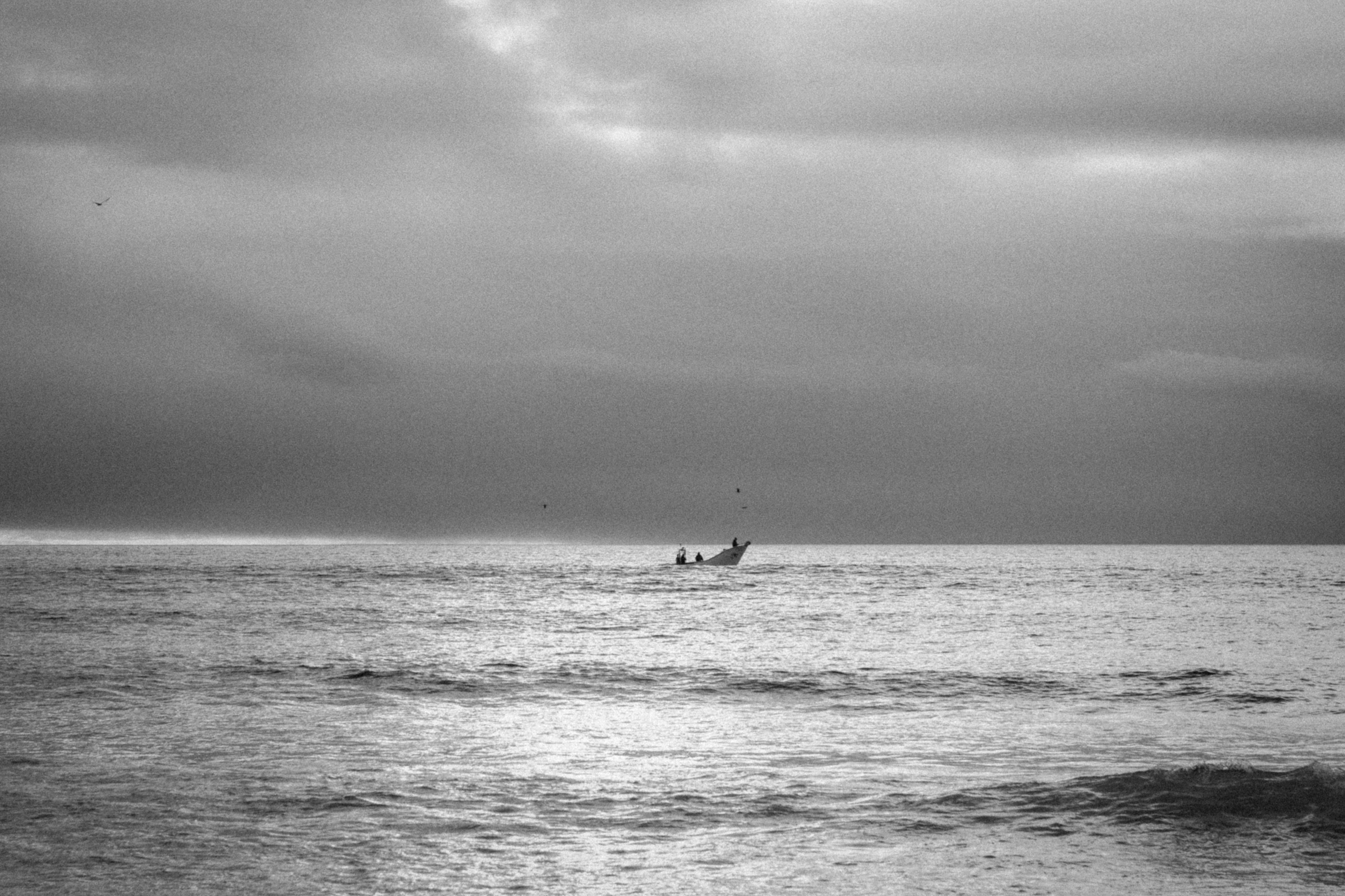 Single Boat on a Luminous Sea