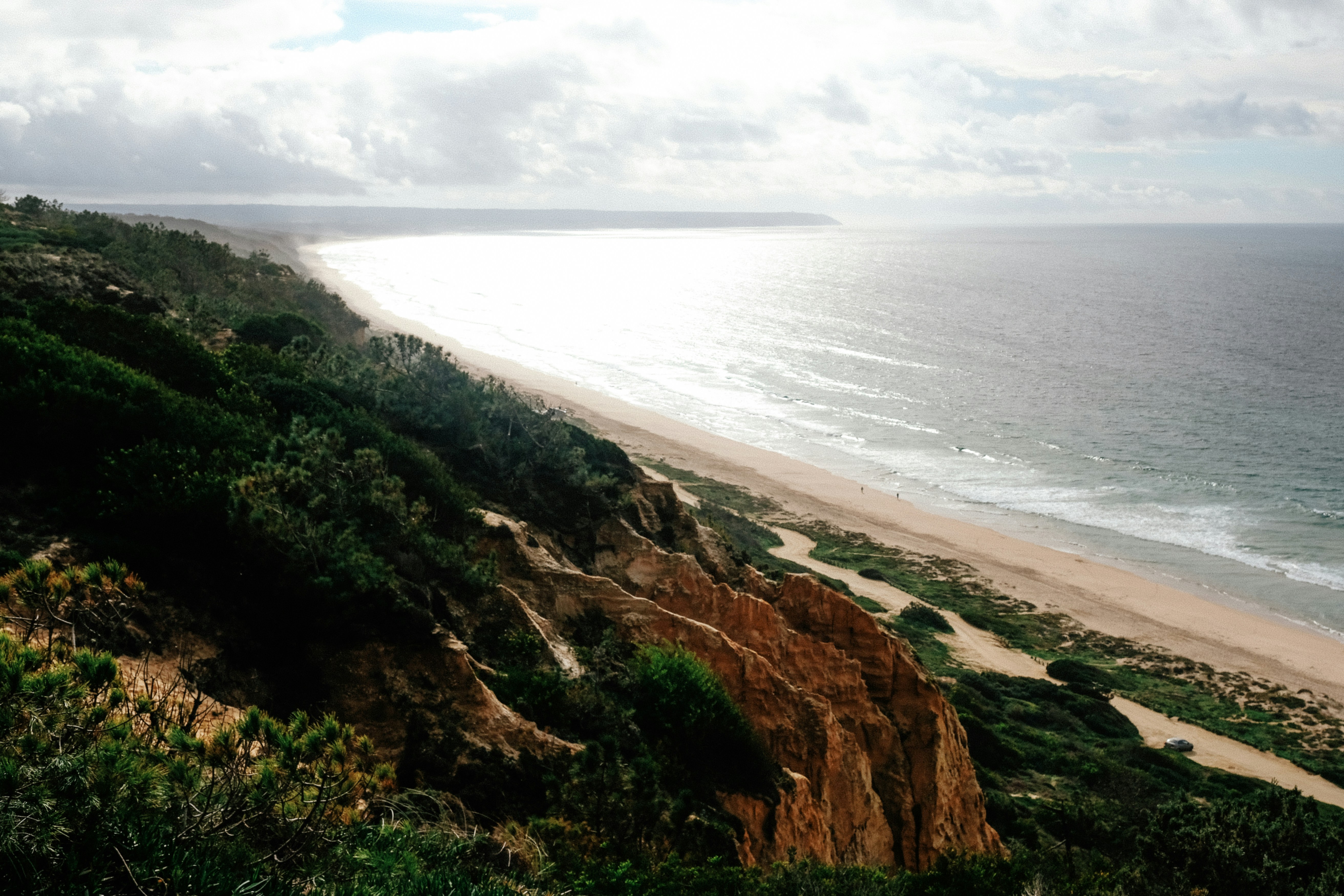 Cliffside Coastline Under Quiet Sun