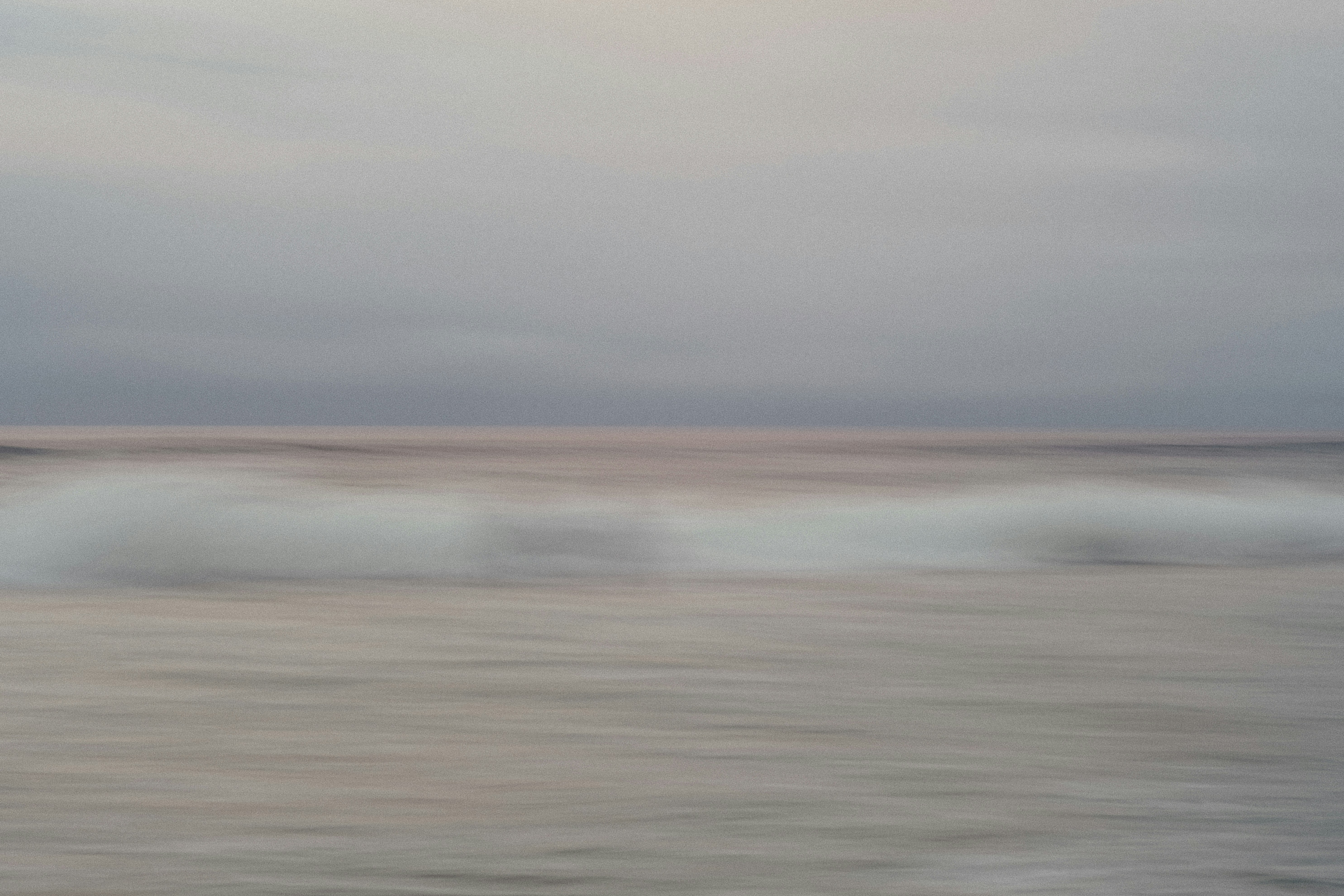 Soft Horizon Drift Across a Misty Seascape