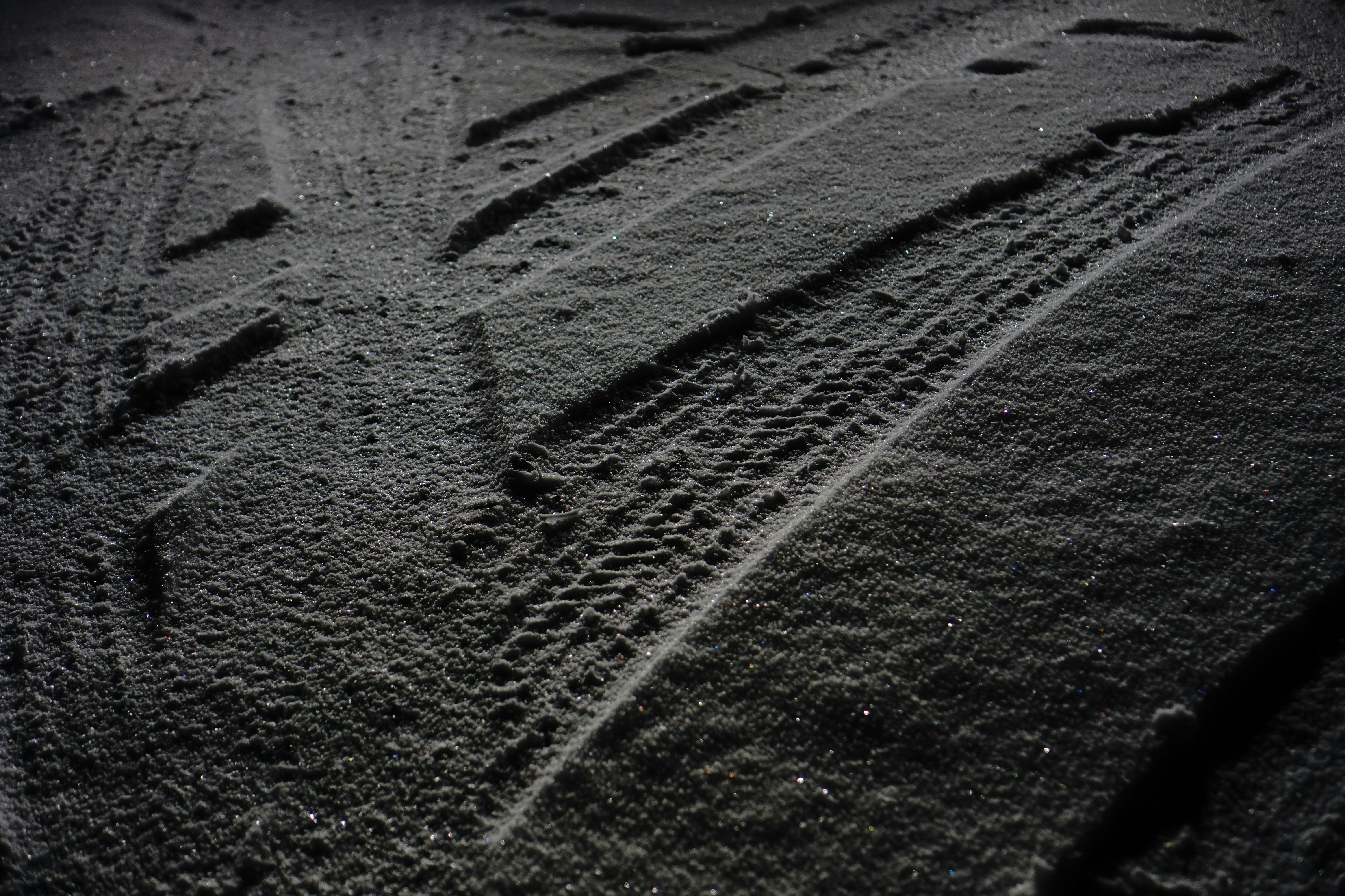 Tire Tracks in Dunes: A Textured Nightscape