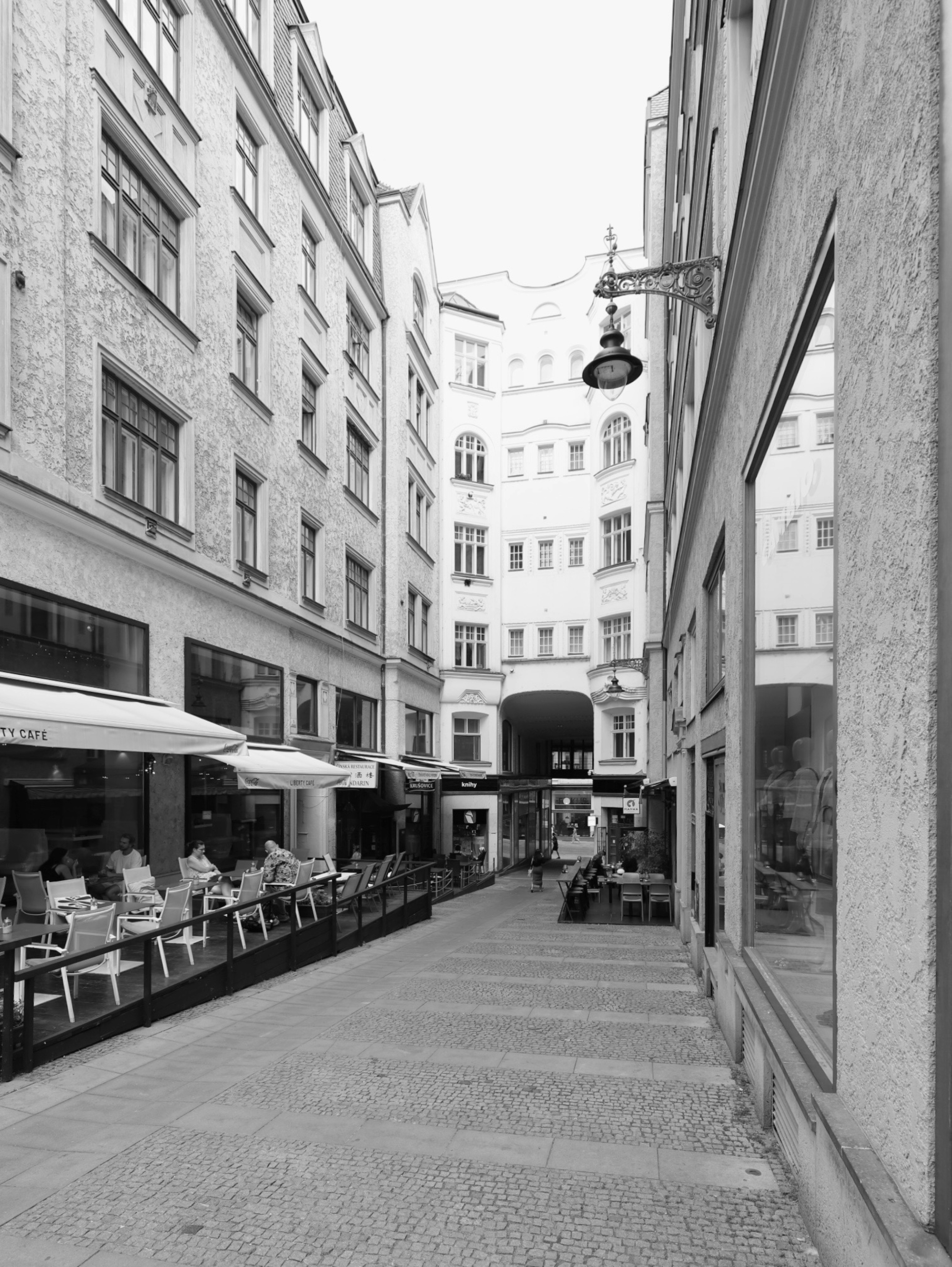 Cobbled Canyon: Courtyard Alley Between Stone Facades