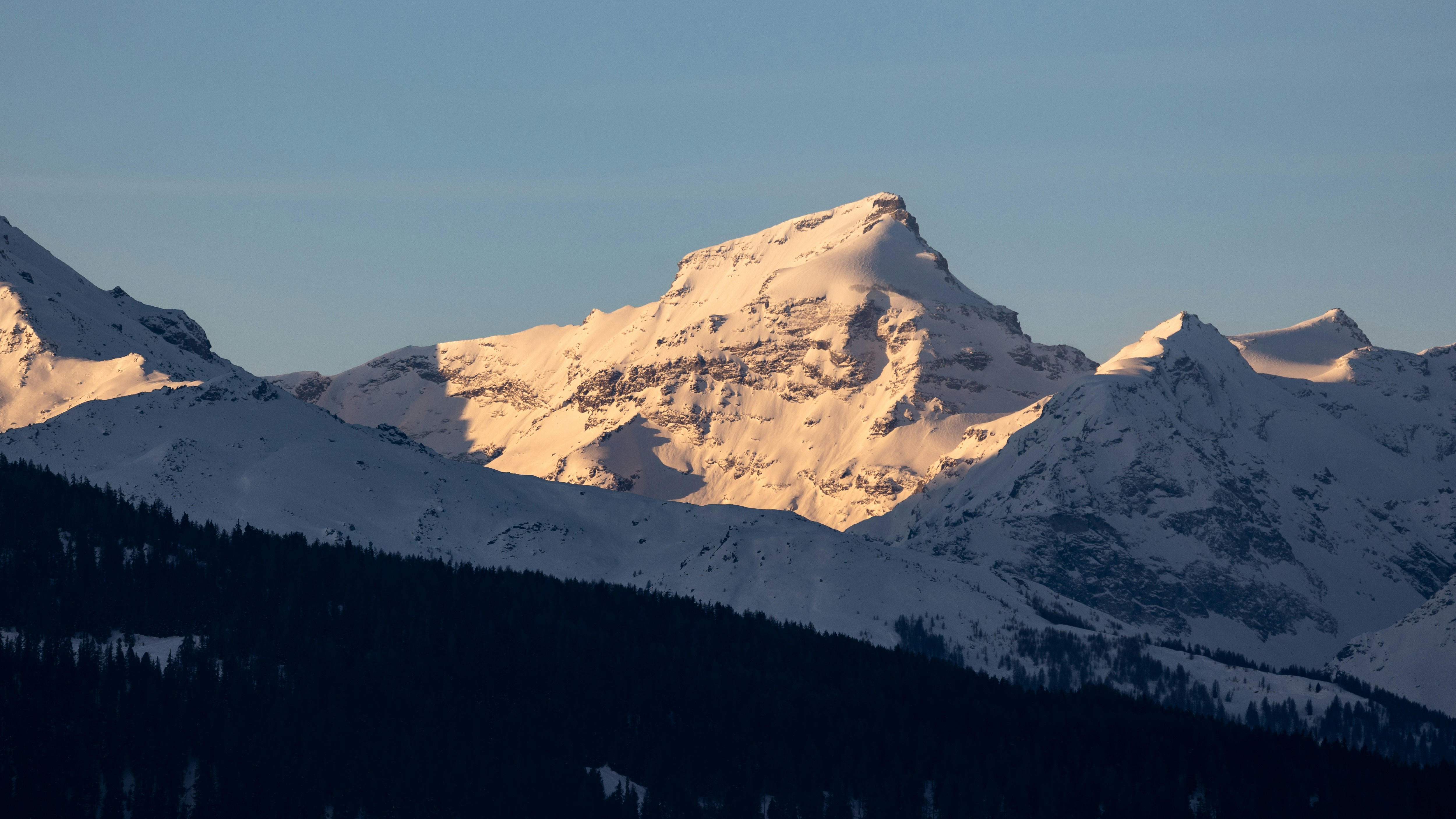 Alpine Crown: the sunlit peak over a shadowed valley