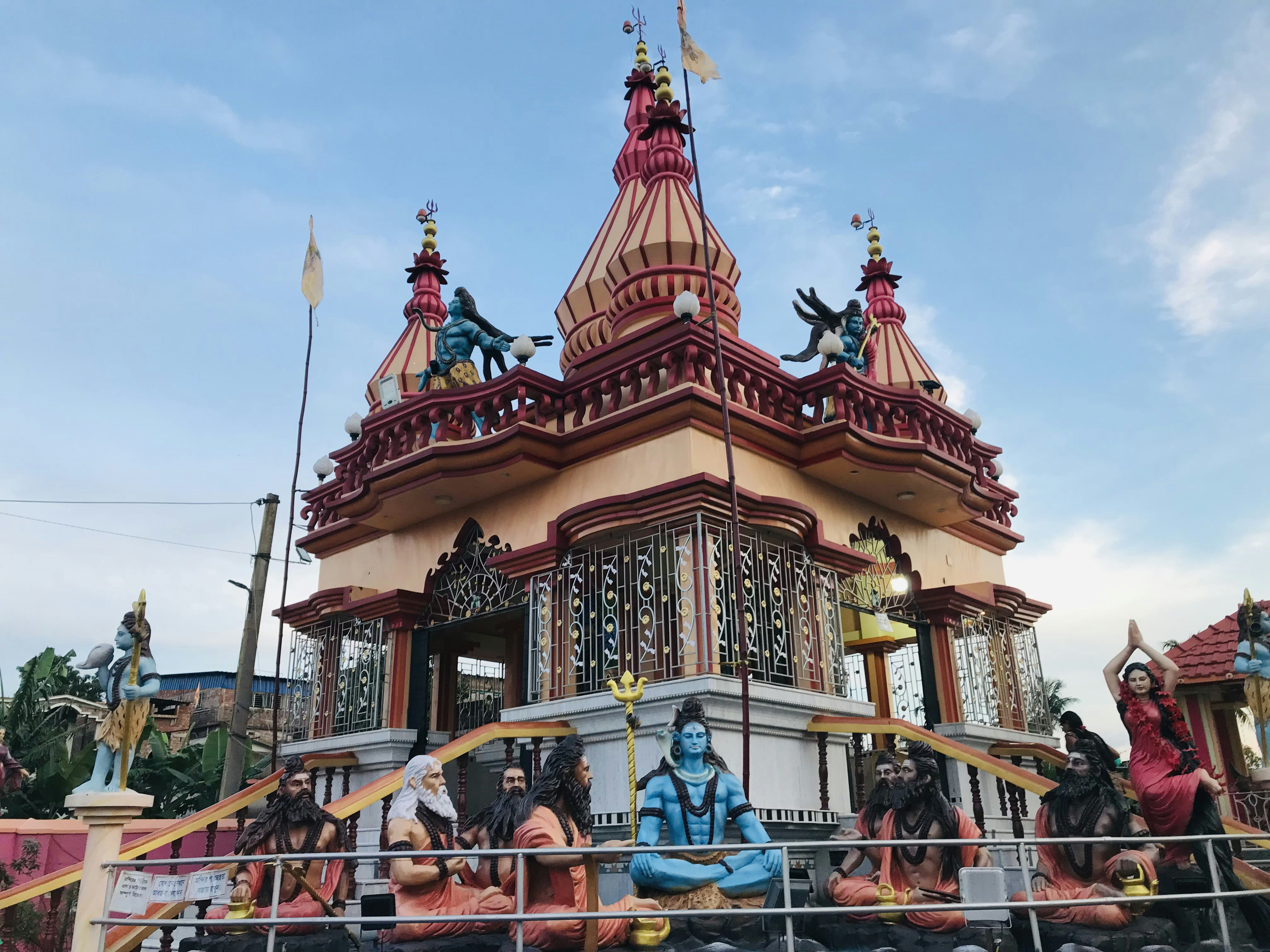 Temple Shrine Rising Above the Street: Colorful Norid Temple with Statues