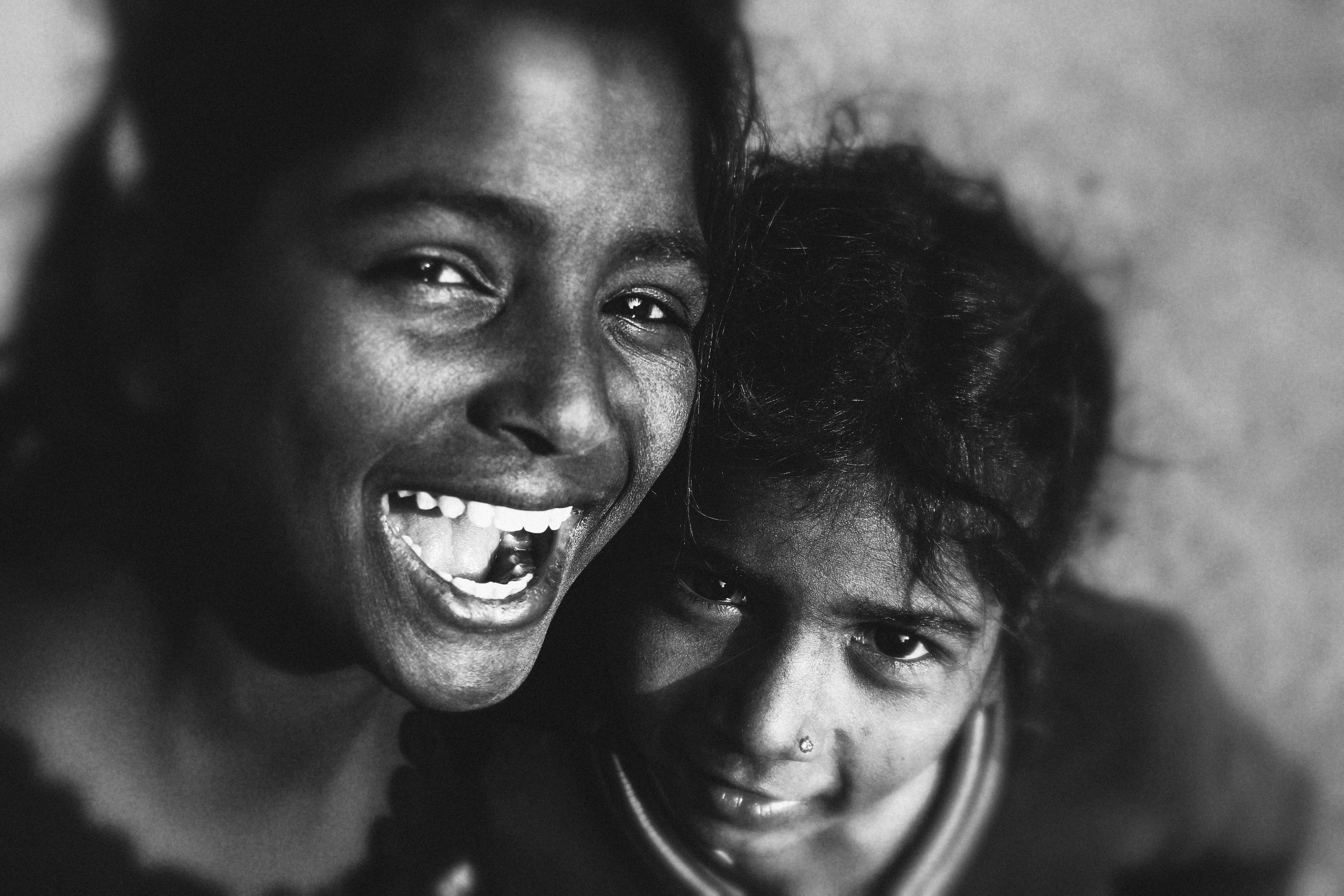 Smiles in Focus: Two Friends Share a Moment