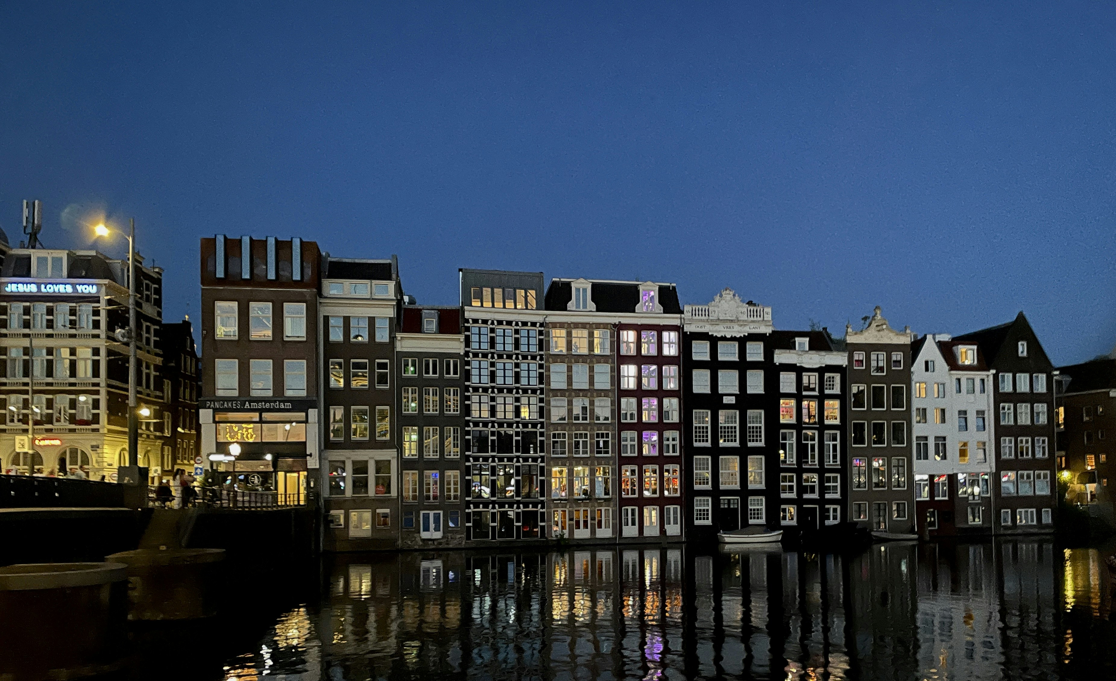 Canalfront Row of Gabled Townhouses at Dusk