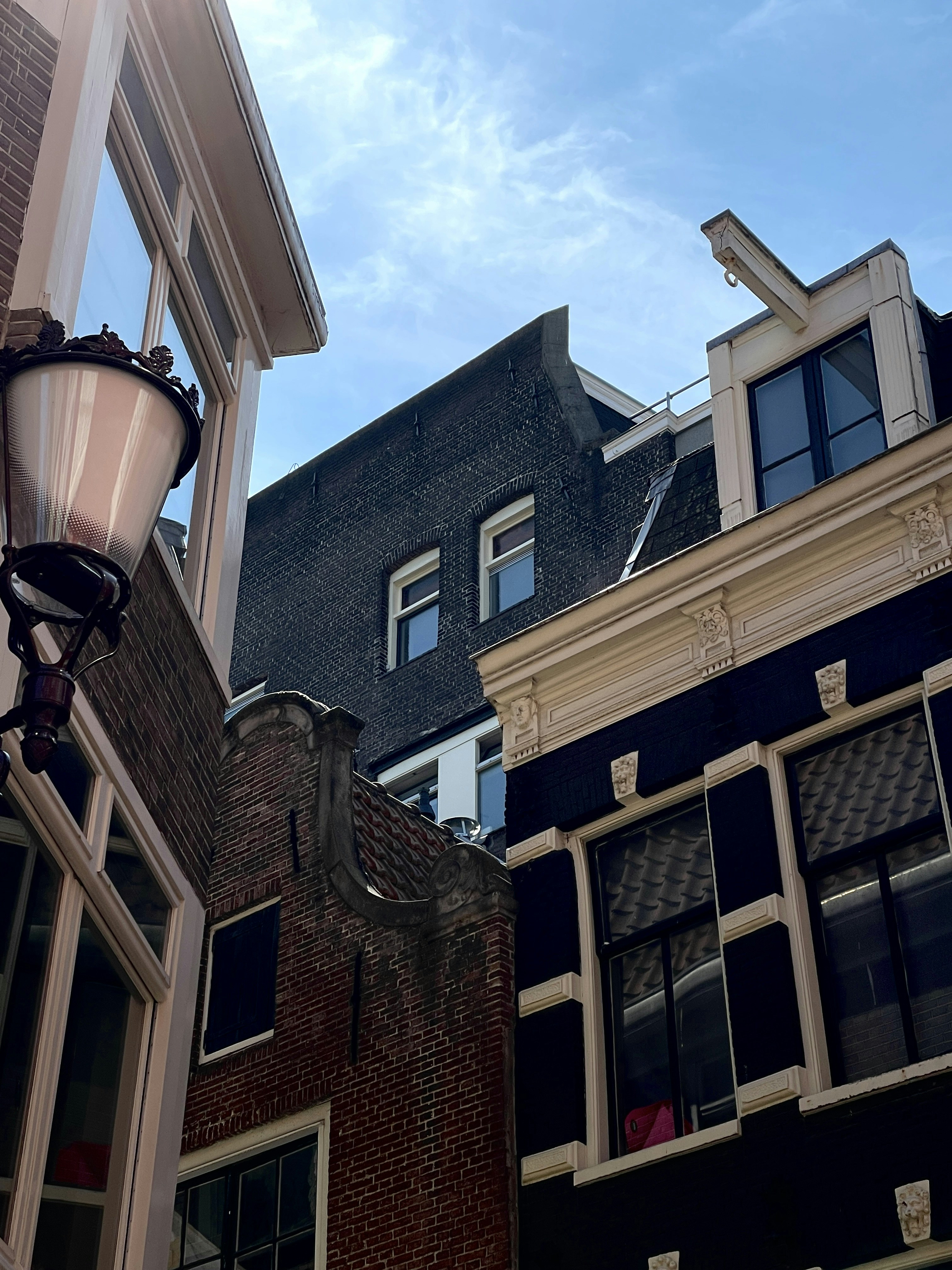 Urban Gables: Sunlit Facades and Historic Windows