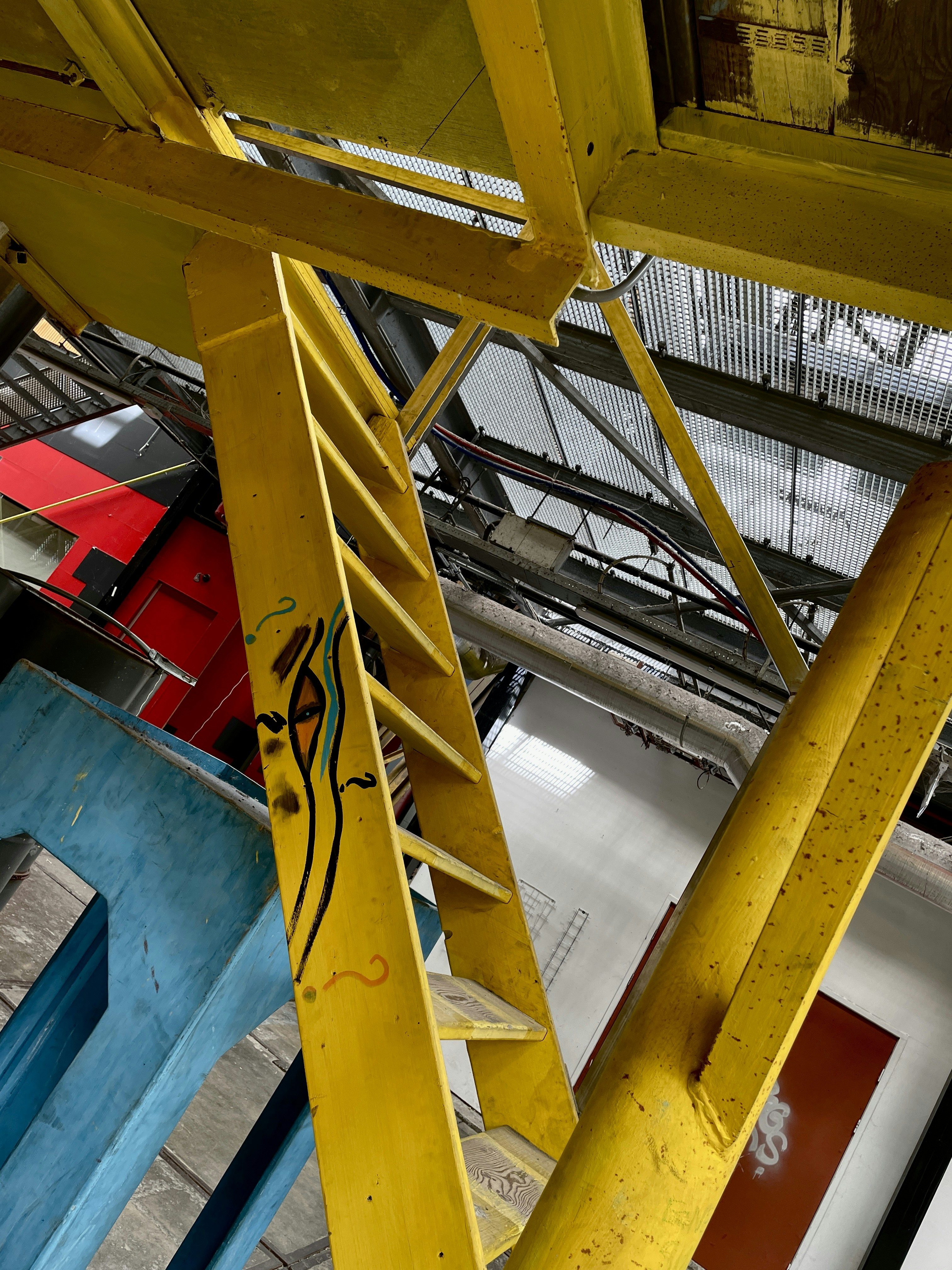 Industrial Geometry: Yellow Beams and Painted Faces