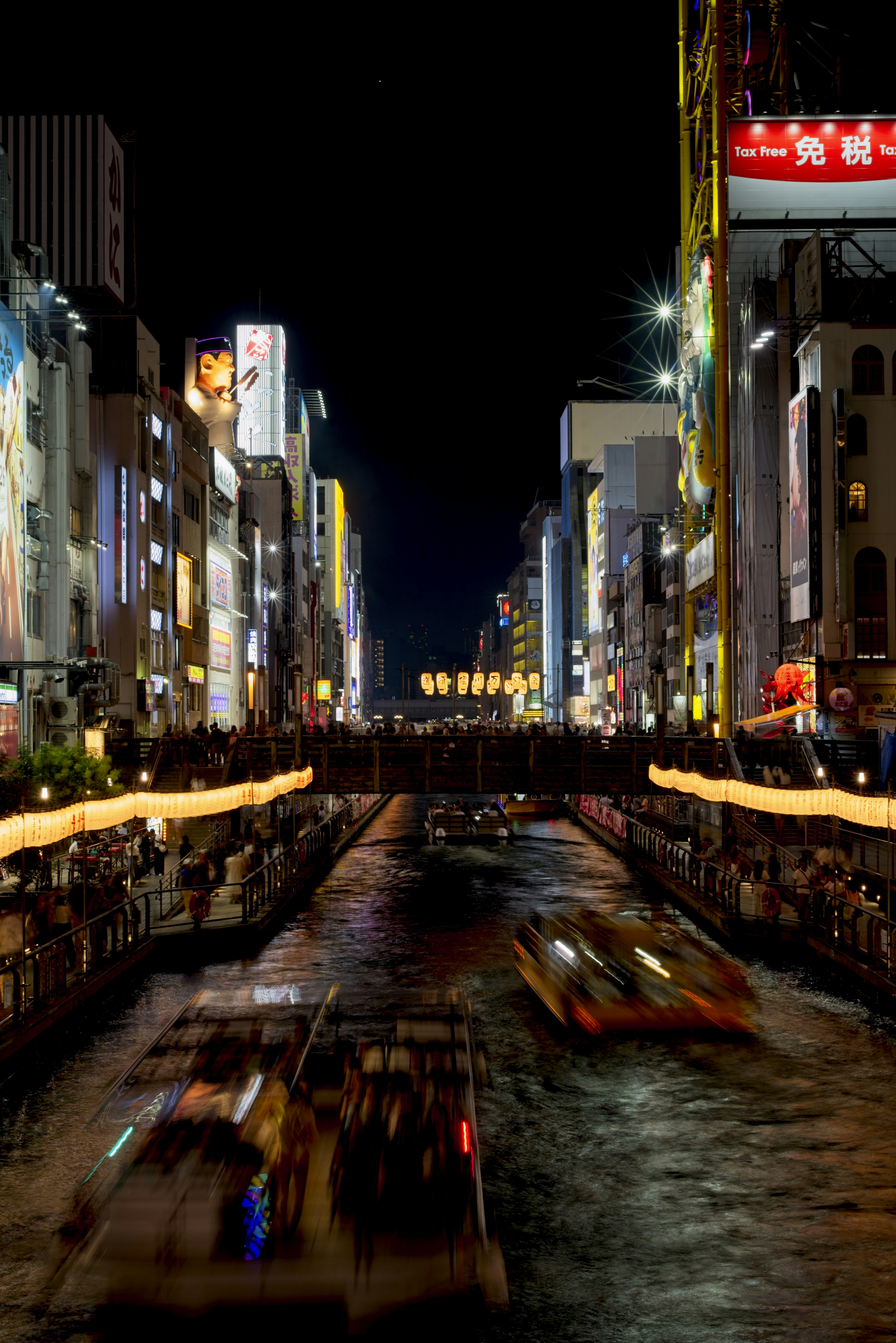 Neon Canal Rush: Night Boats through a Living City