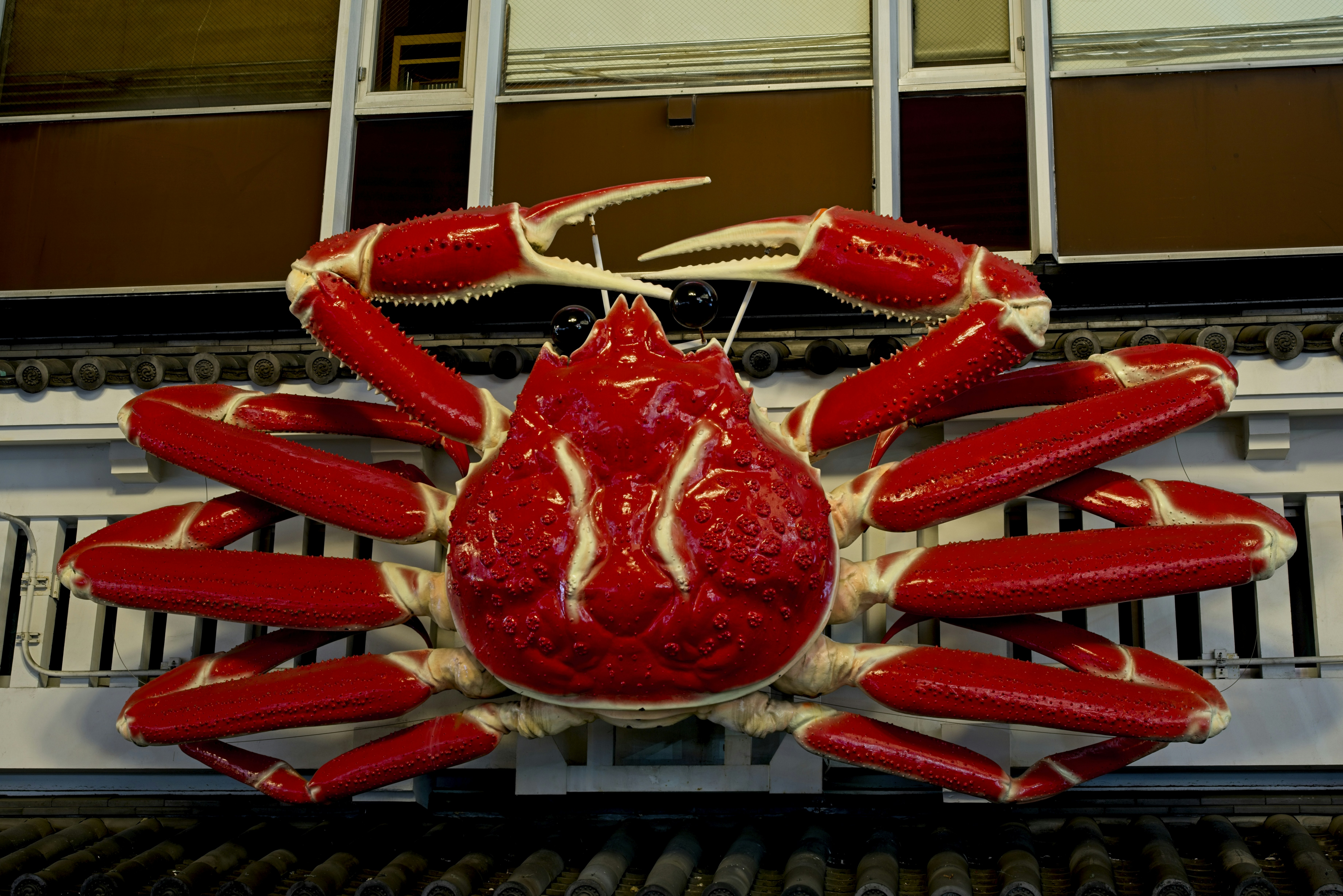 Crimson Crown: A Lobster Parade Adorning the Facade